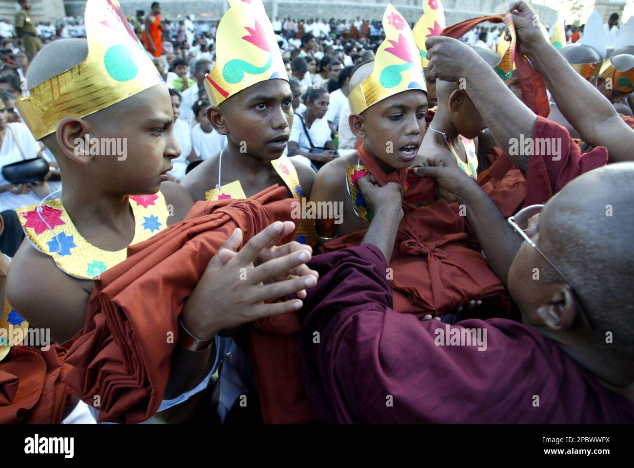 Young boys participate in a ceremony to be ordained as Samanera, or a ...