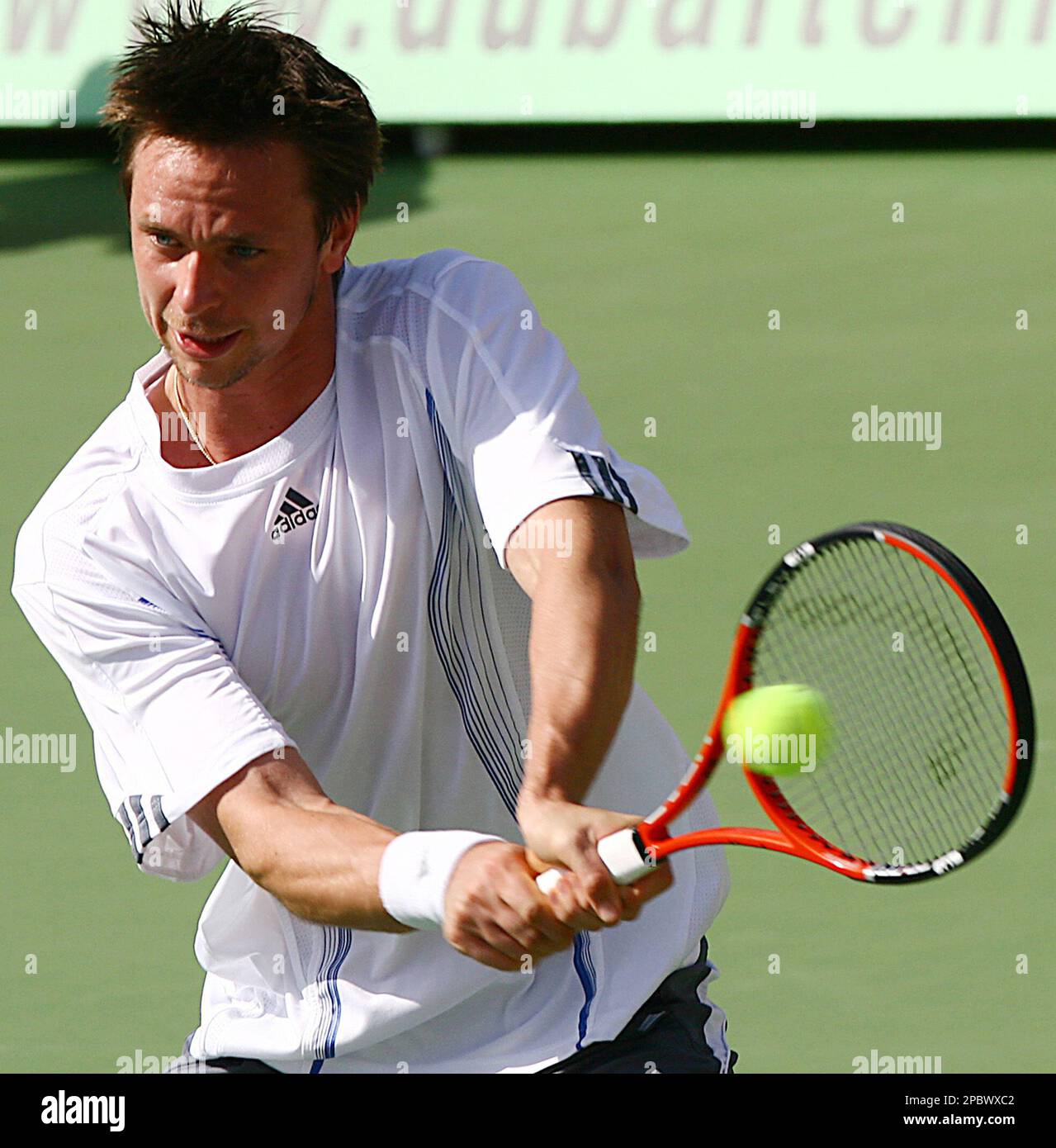 Robin Soderling from Sweden returns the ball to Fabrice Santoro of ...