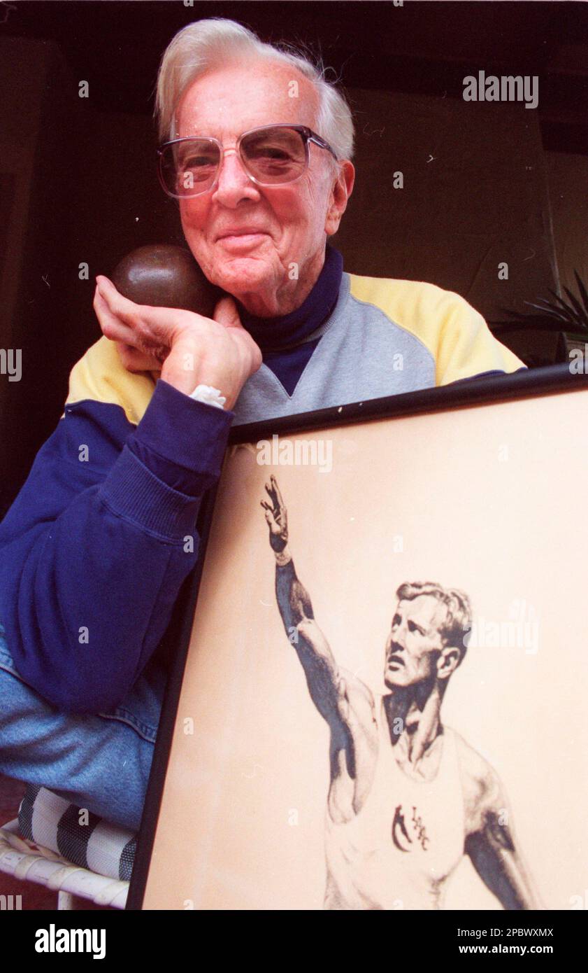 ** FILE ** Former Olympian Herman Brix sits with his shot put from the ...