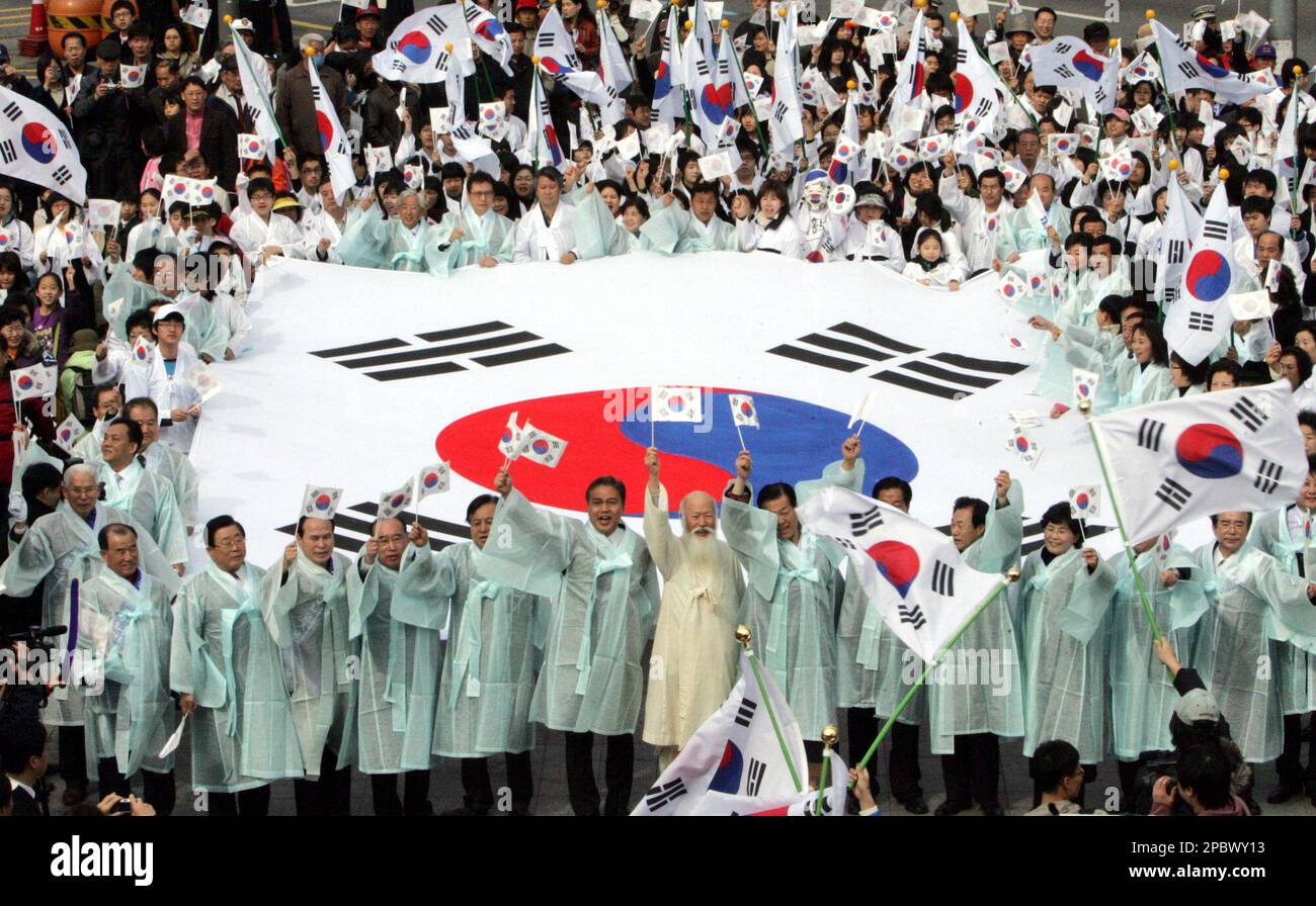South Korean wearing traditional Korean costumes wave the national ...