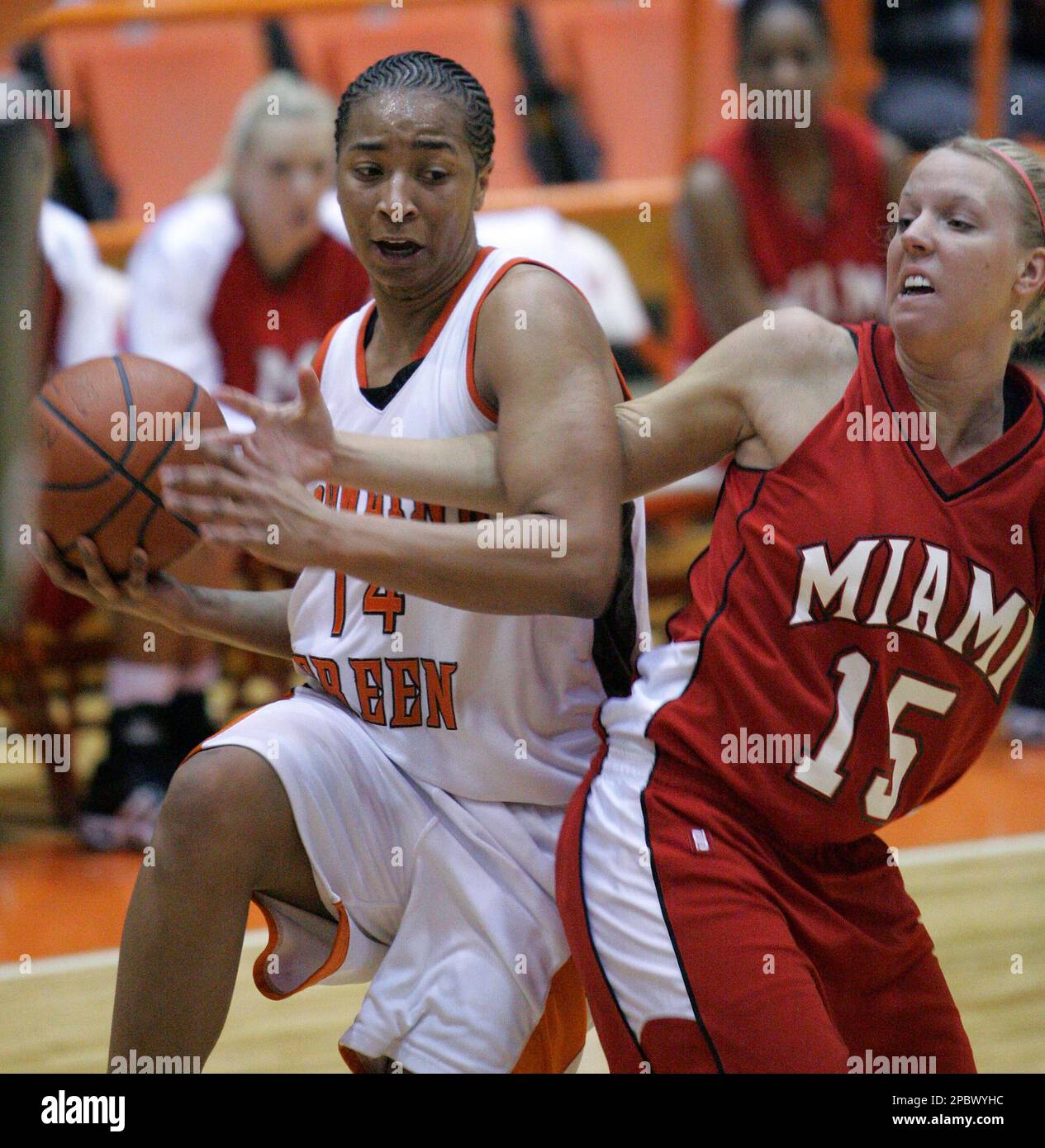 Bowling Green's Carin Horne (14) tangles with Miami (Ohio)'s Sarah Hull ...