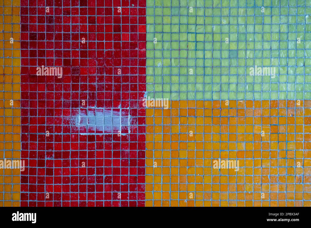 Colored ceramic tiles mosaic wall. Close up shot of old textured square ...