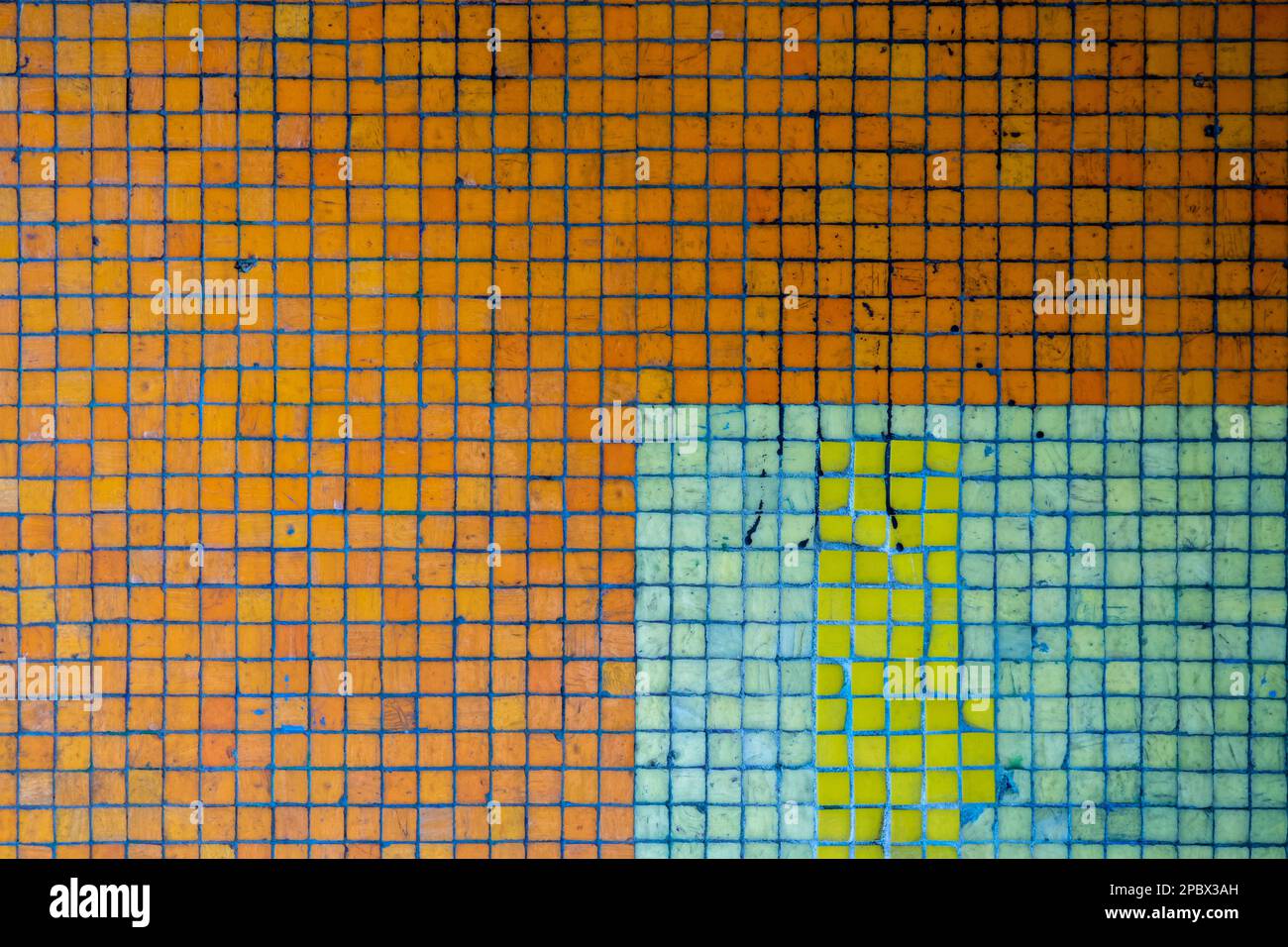 Colored ceramic tiles mosaic wall. Close up shot of old textured square ...