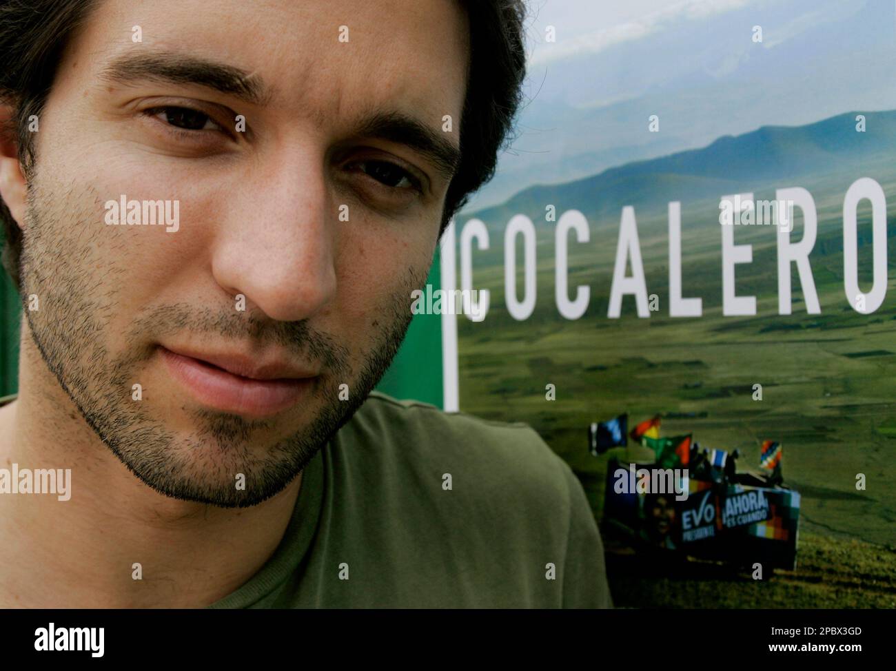 Film director Alejandro Landes poses next to a poster from his documentary film "Cocalero ...