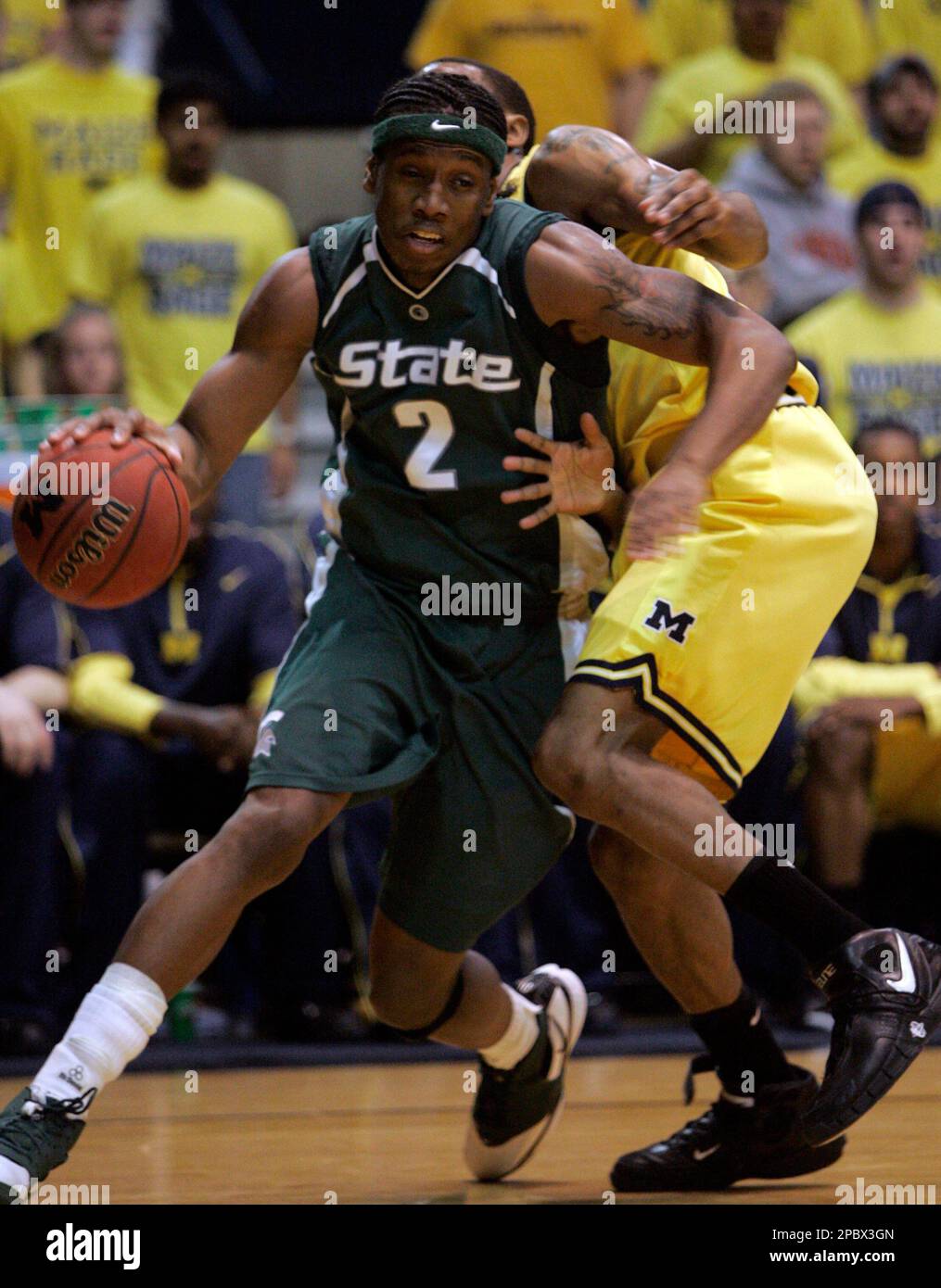 Michigan State forward Raymar Morgan (2) drives around Michigan forward ...