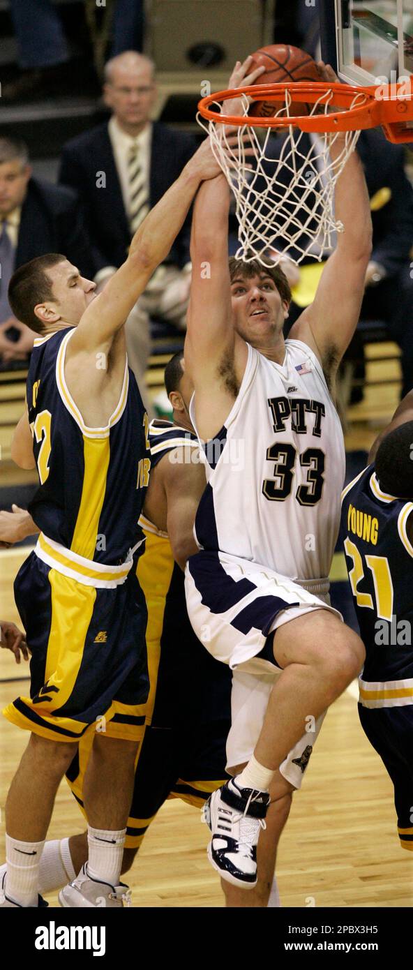 Pittsburgh's Aaron Gray, right, is fouled by of West Virginia's Alex ...