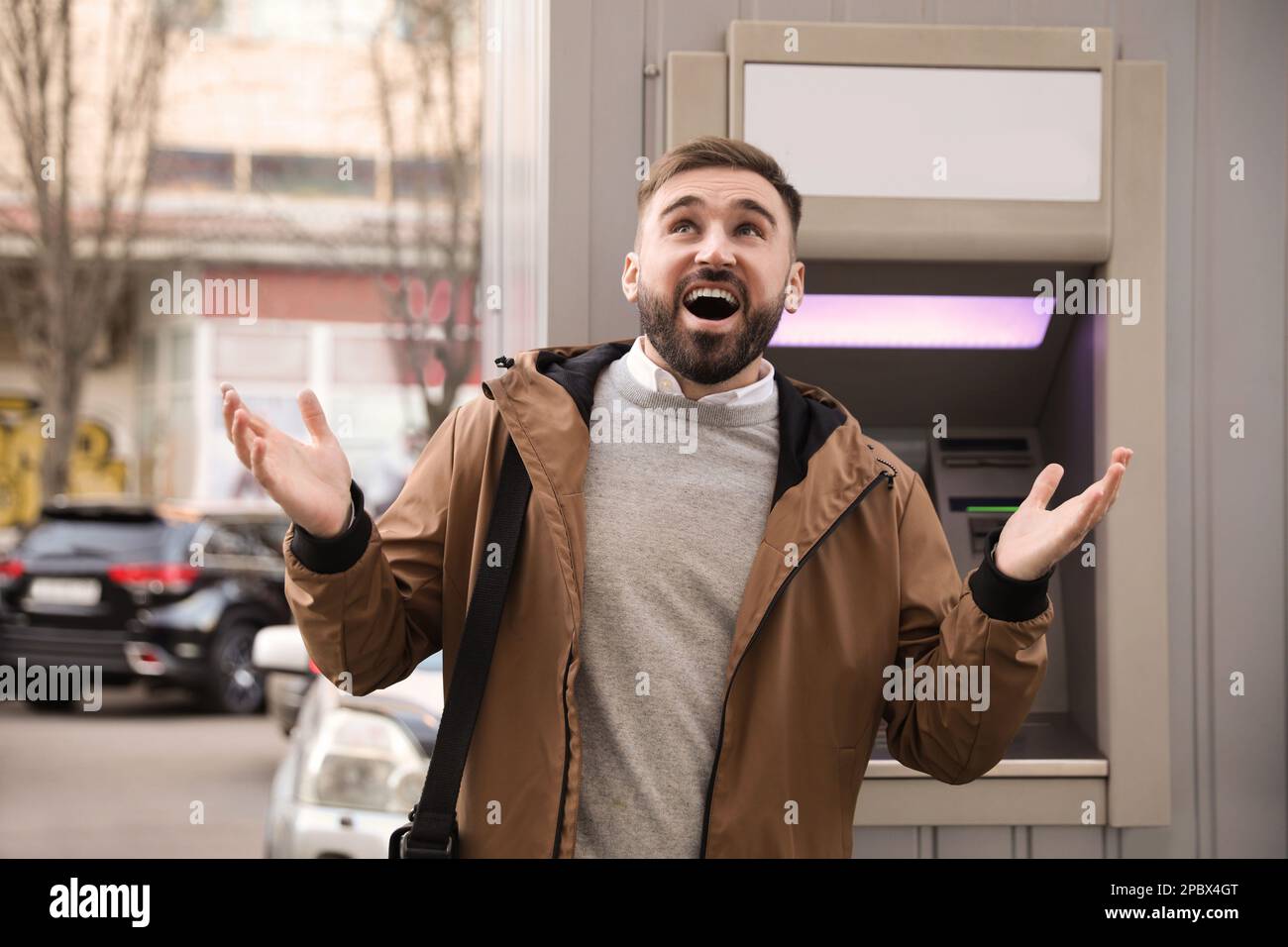 Young man cash machine hi-res stock photography and images - Alamy