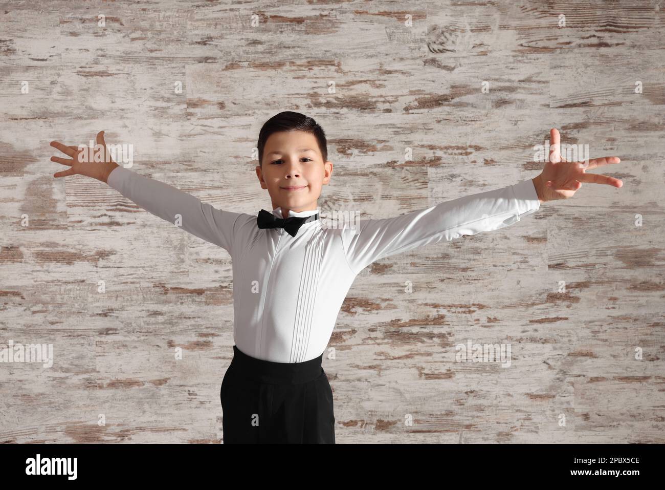 Beautifully dressed little boy dancing in studio Stock Photo - Alamy