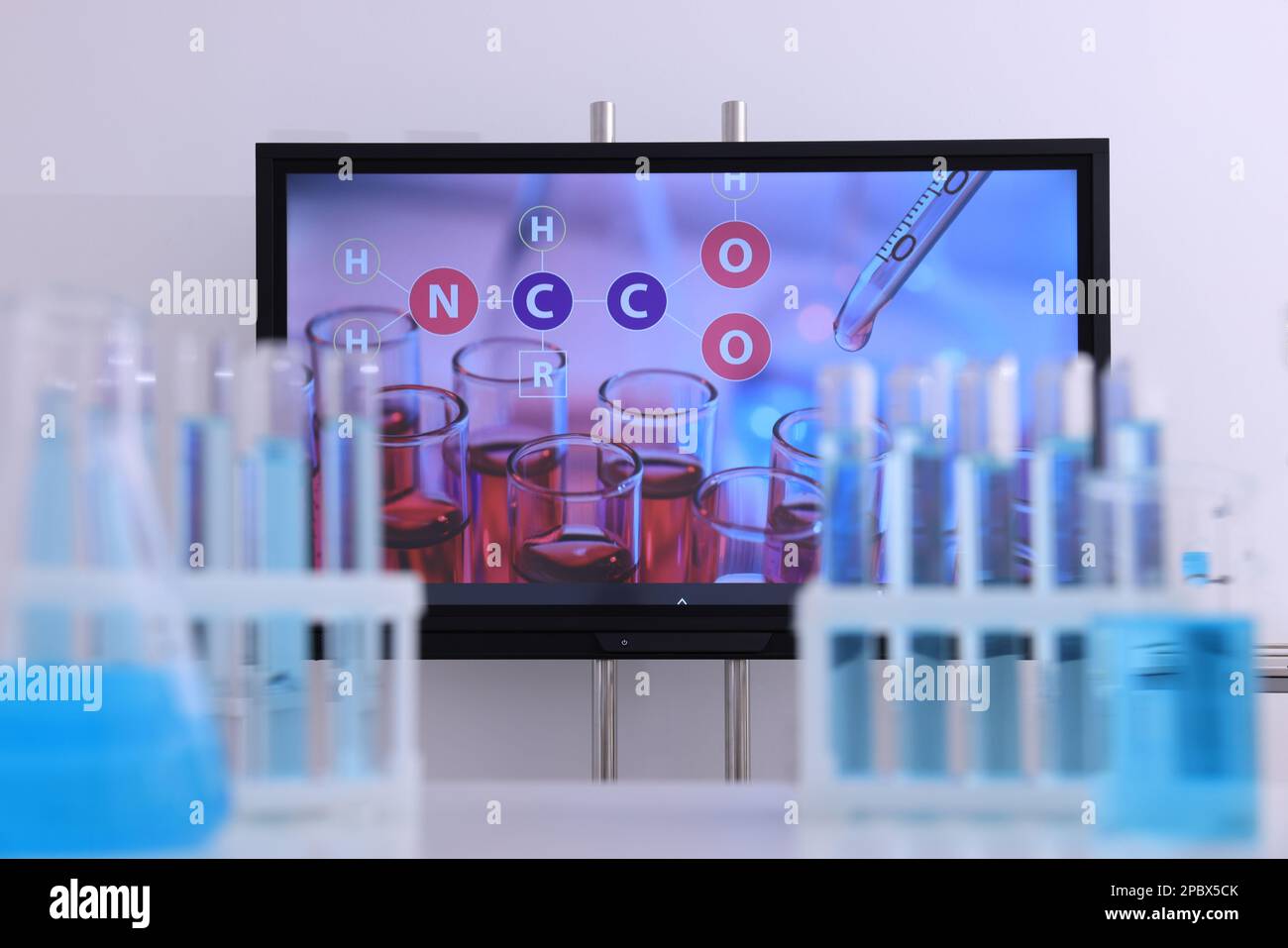 Modern interactive board and laboratory glassware in classroom Stock ...