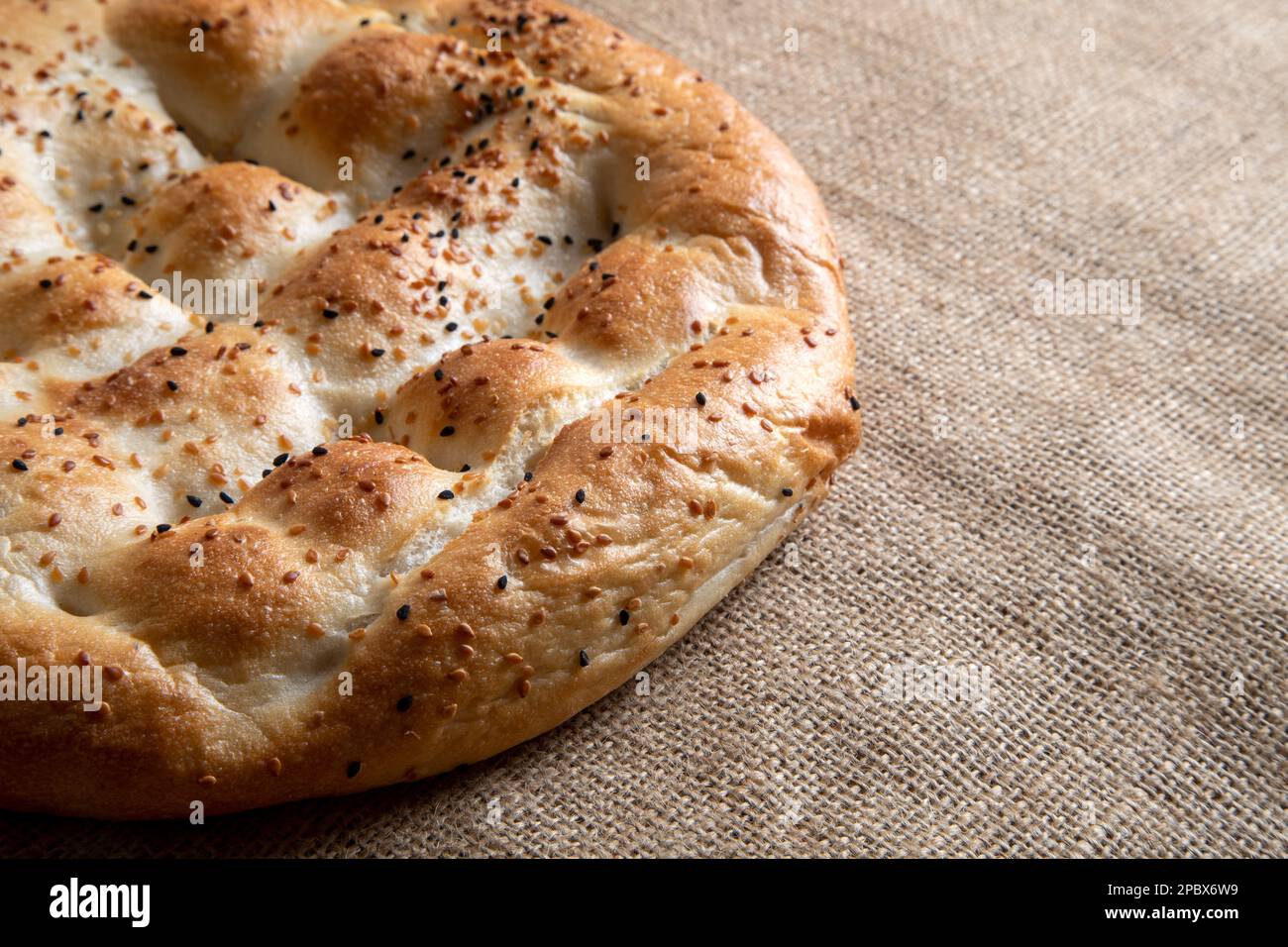 Traditional Ramadan pita on burlap sack.Holy bread for Muslims Stock ...
