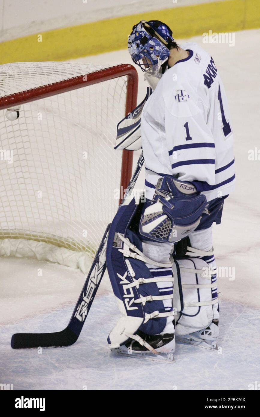 Toronto Maple Leafs goalie Andrew Raycroft scrapes at the ice in his ...