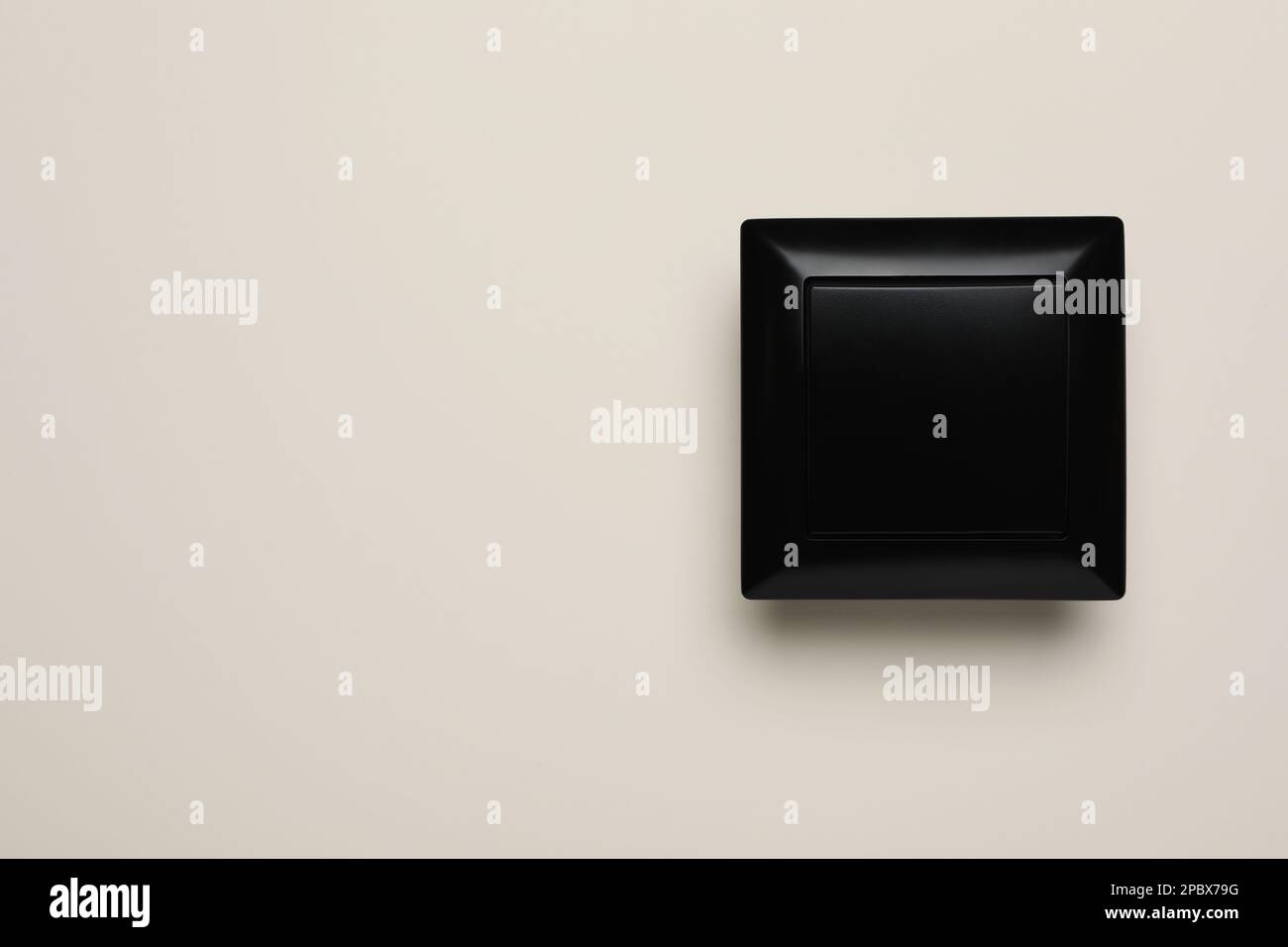 Black light switch on beige background, top view. Space for text Stock ...