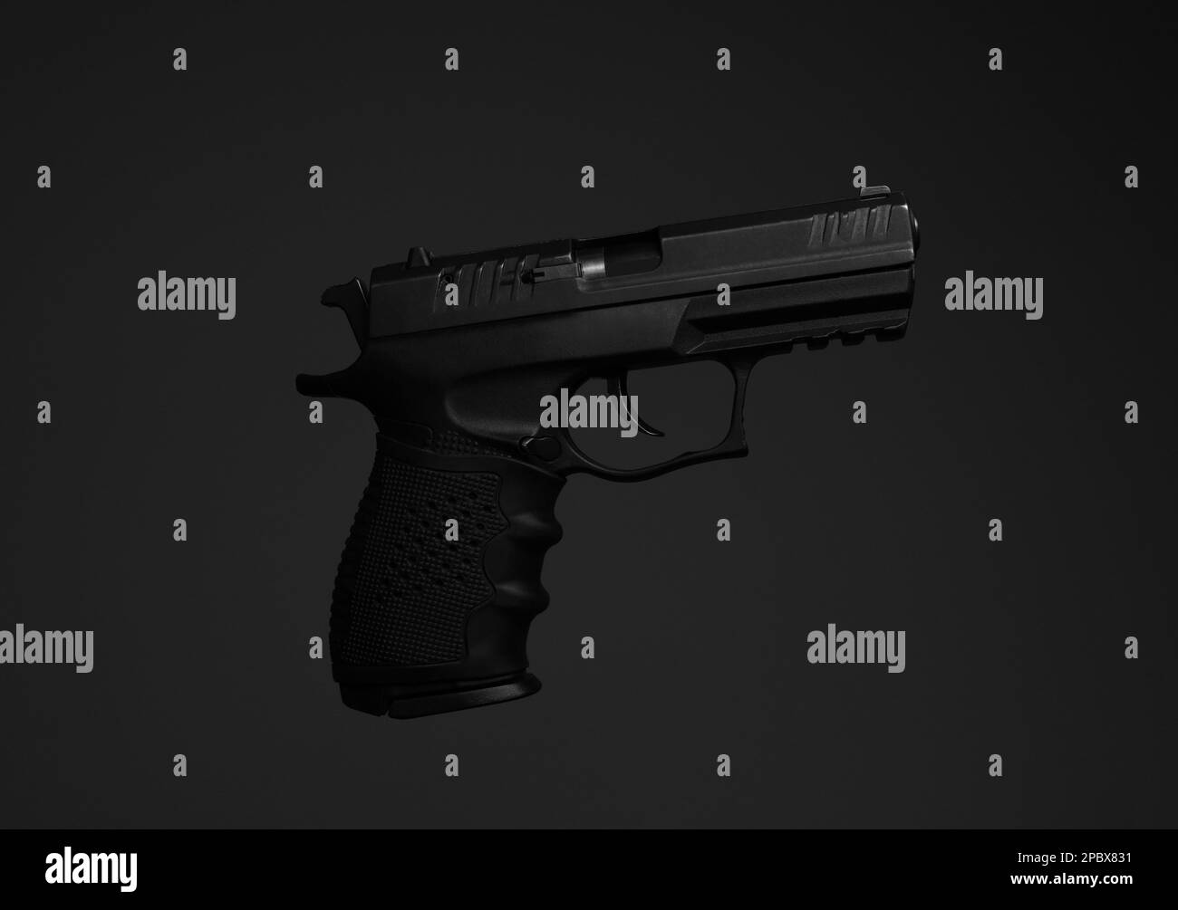 Standard handgun on dark background. Semi-automatic pistol Stock Photo ...