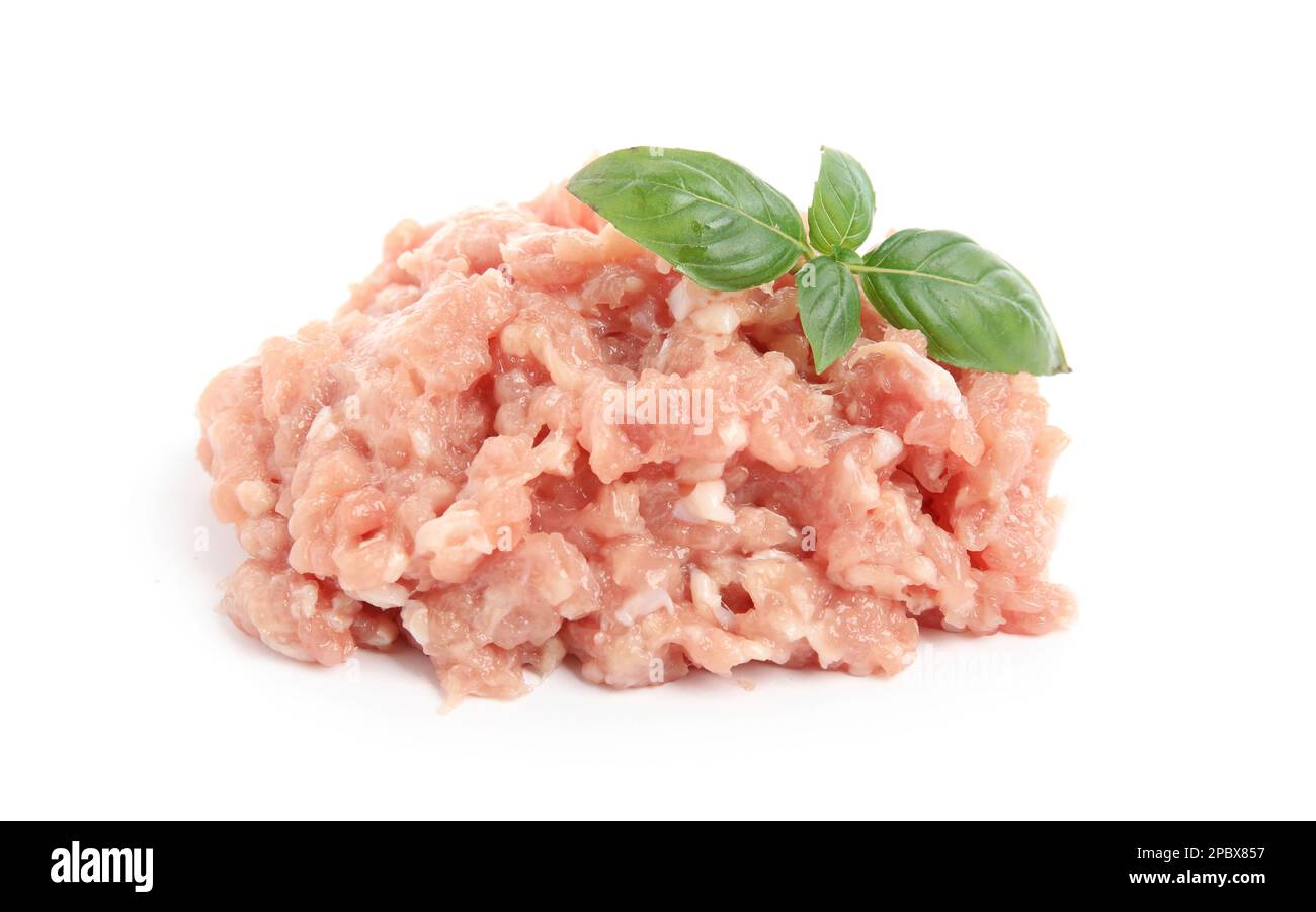 Pile of raw chicken minced meat with basil on white background Stock ...