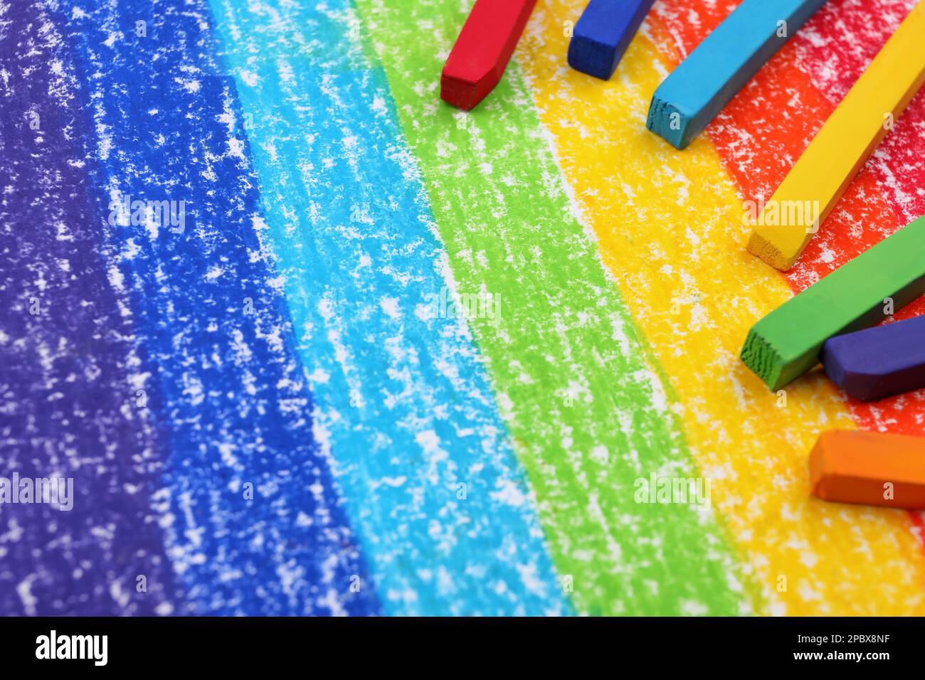 Colorful pastel chalks on drawing of rainbow. Space for text Stock ...
