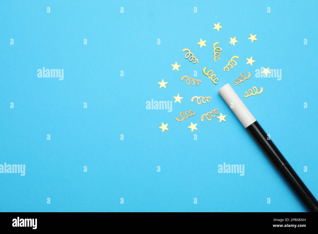 Beautiful black magic wand and confetti on light blue background, flat ...