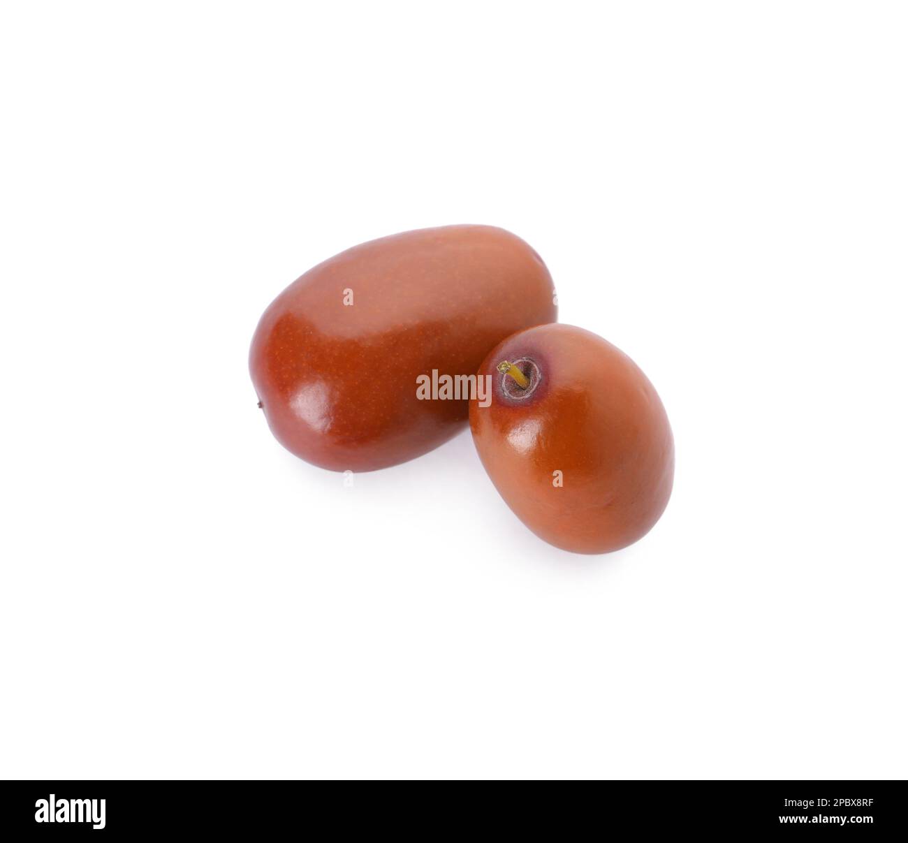 Two ripe red dates on white background, top view Stock Photo - Alamy