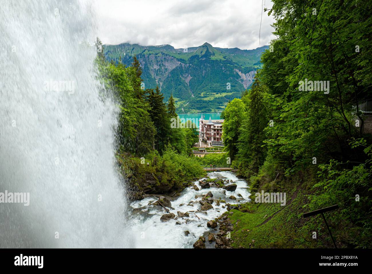 Dramatic view of the Giessback waterfall and Grand Hotel Giessbach in ...