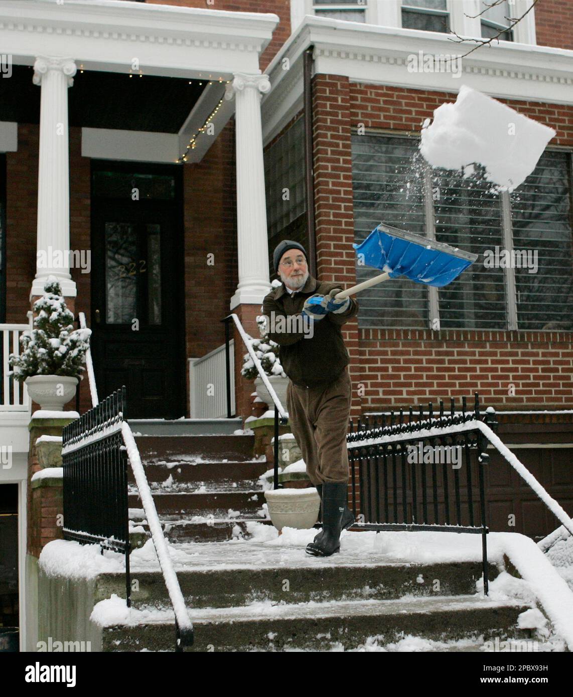 Brooklyn resident Tom Parker gets his exercise by shoveling heavy, wet ...