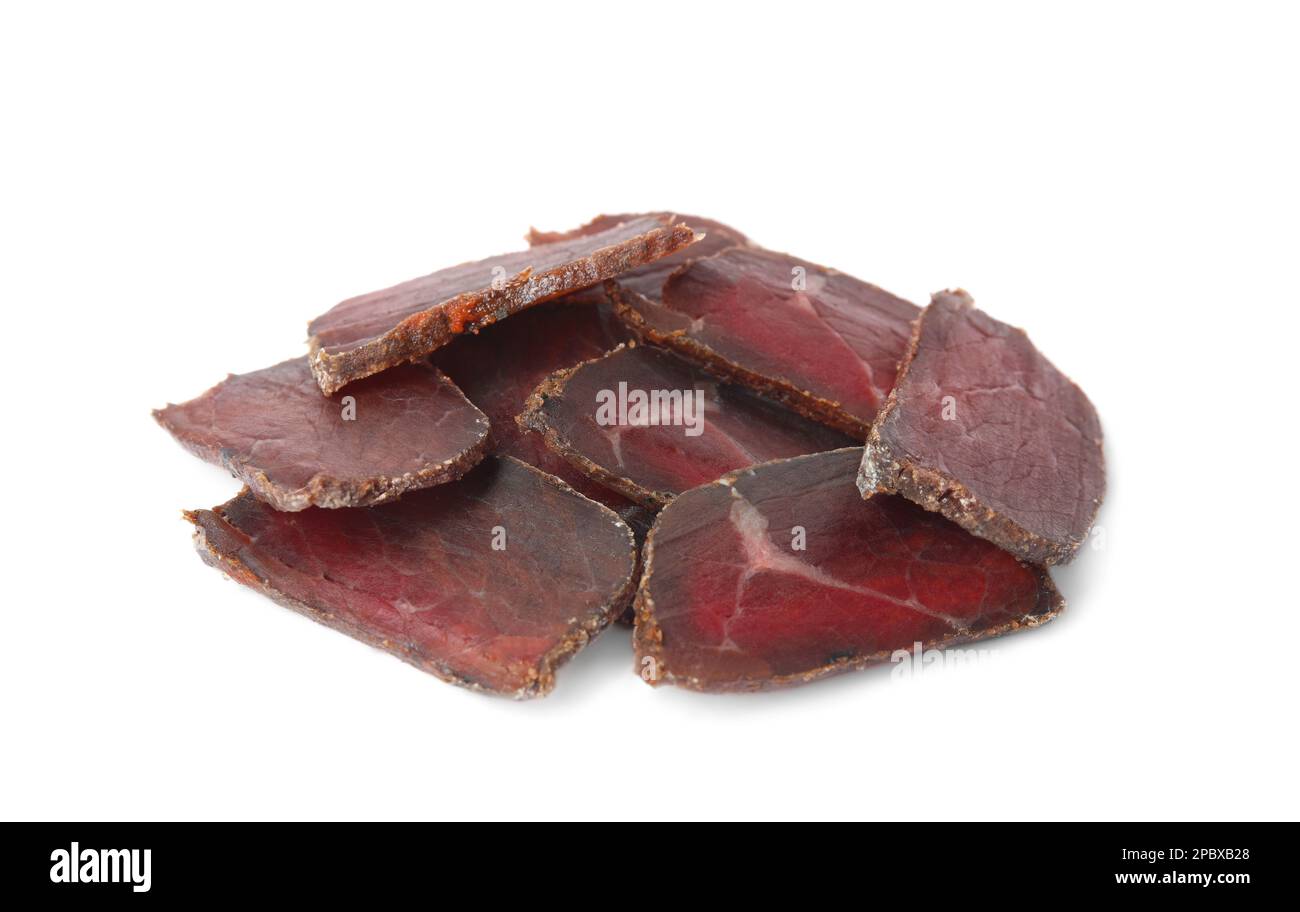 Delicious dry-cured beef basturma slices on white background Stock ...