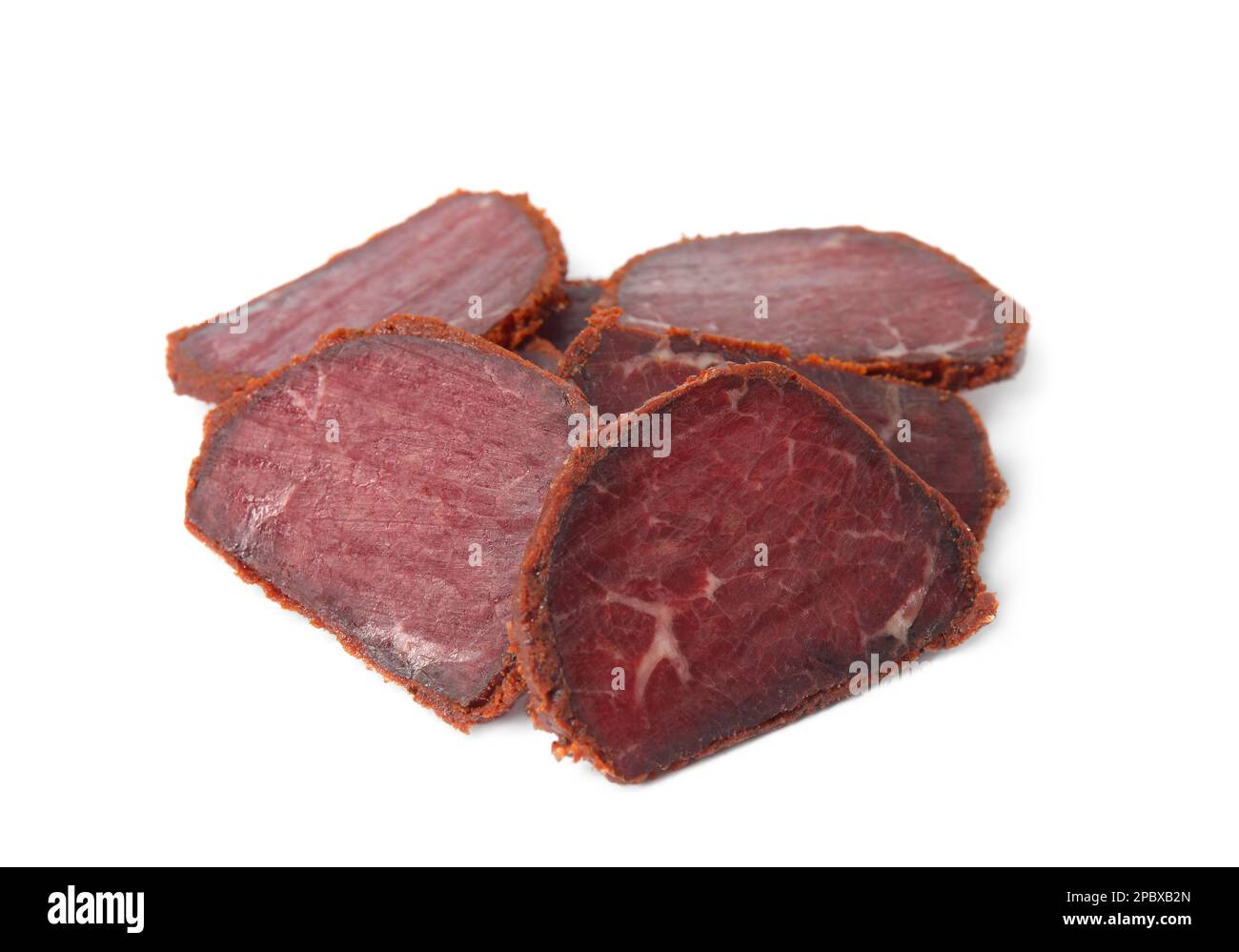 Delicious dry-cured beef basturma slices on white background Stock ...