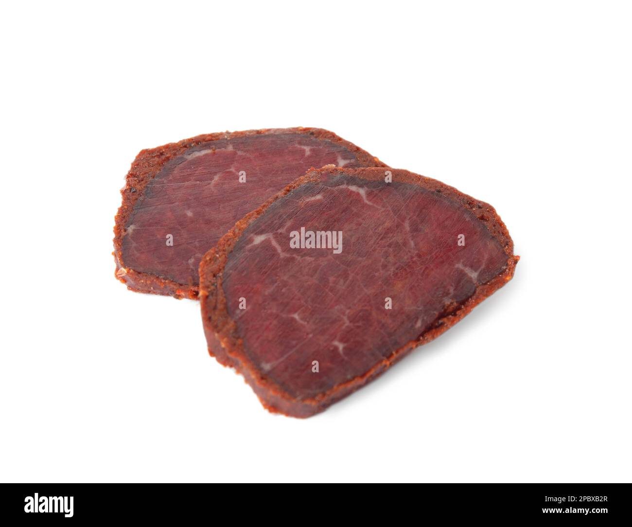 Delicious dry-cured beef basturma slices on white background Stock ...