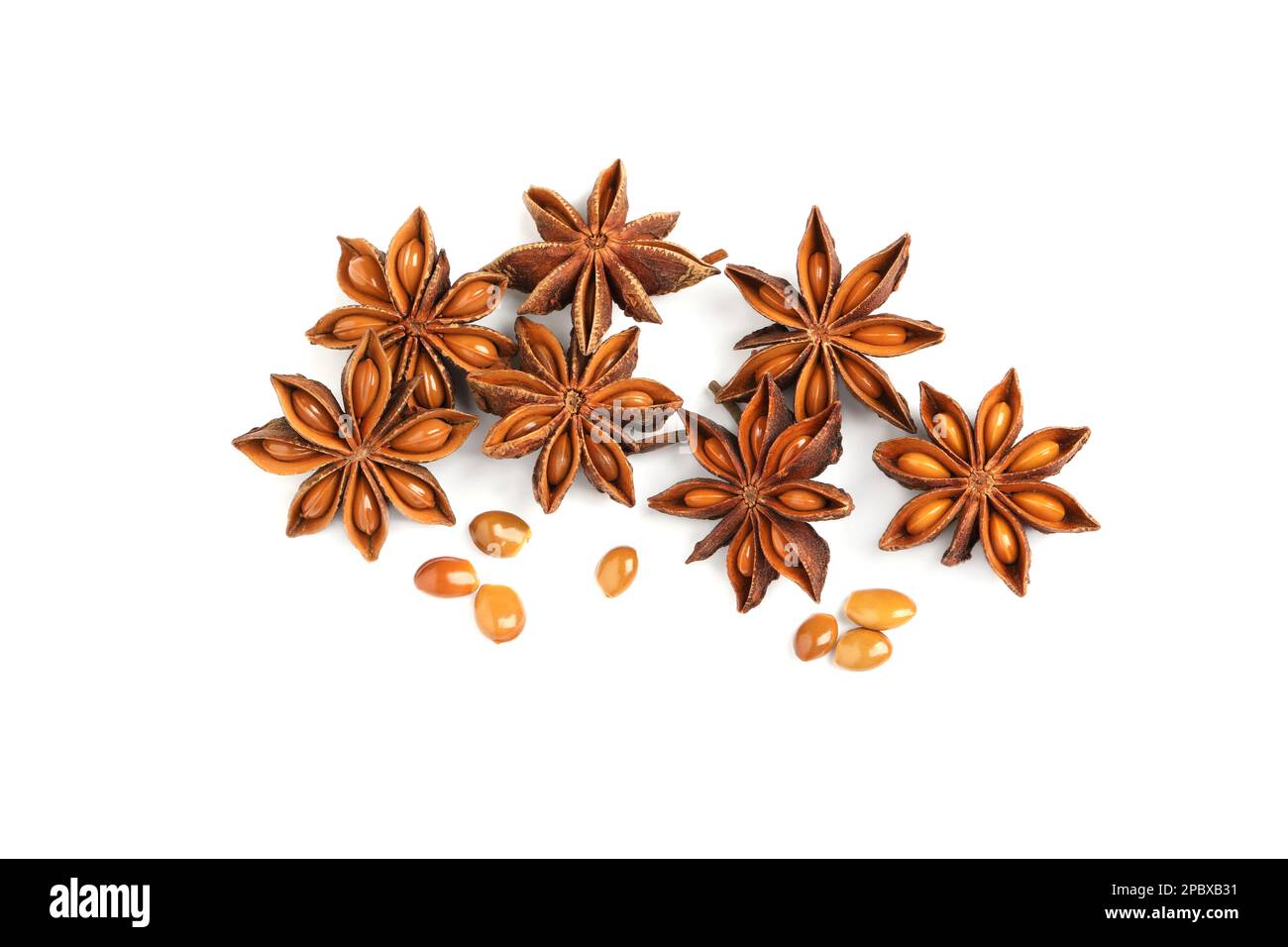 Dry anise stars with seeds on white background Stock Photo - Alamy
