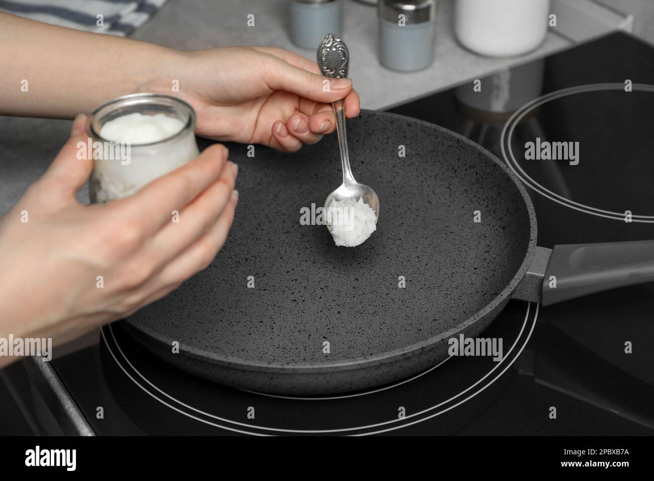 Woman coconut oil cook hi-res stock photography and images - Alamy