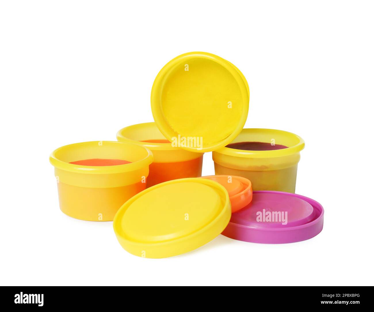 Plastic containers with colorful play dough on white background Stock ...