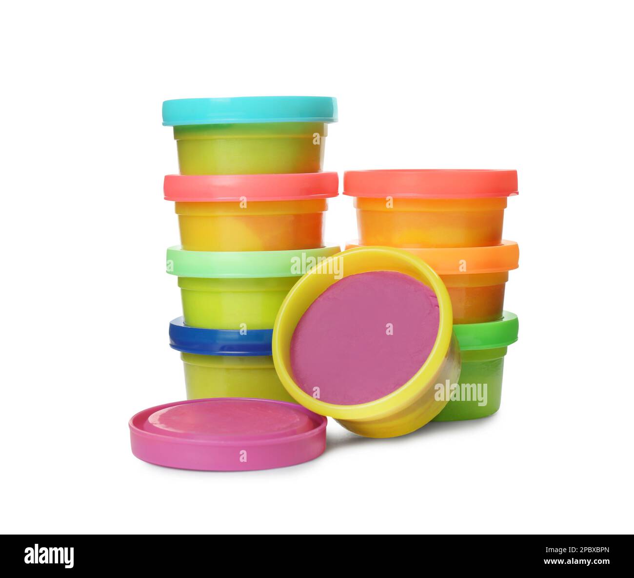 Plastic containers with colorful play dough on white background Stock ...