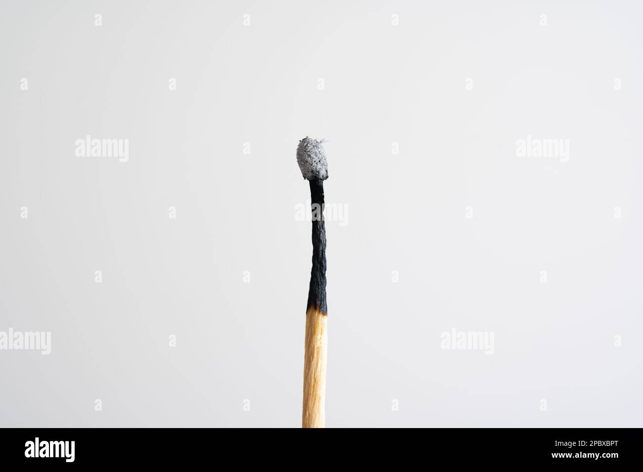 Single burnt matchstick macro close up shot, isolated on white ...