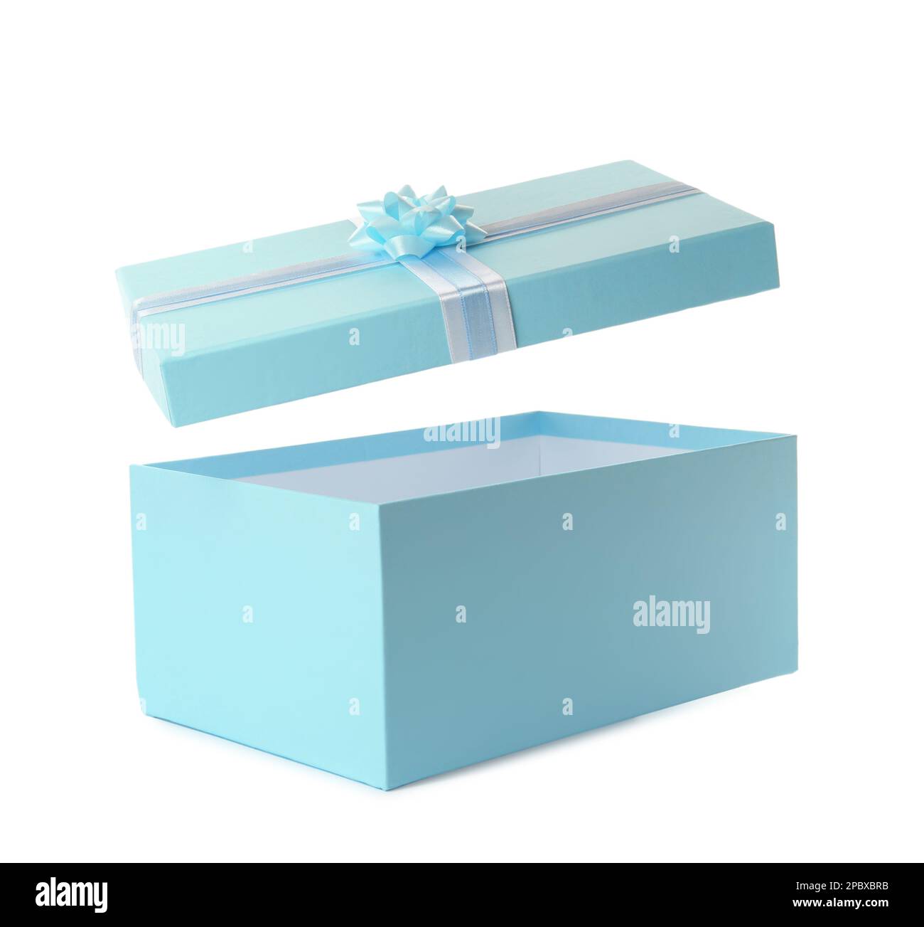 Light blue gift box and lid with bow on white background Stock Photo ...