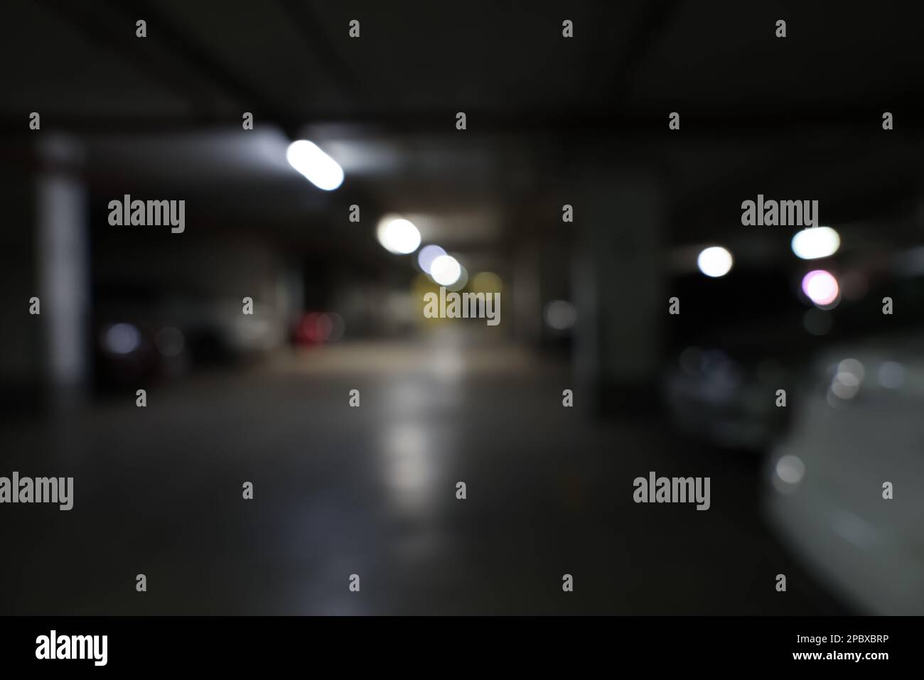 Blurred view of car parking garage at night Stock Photo - Alamy