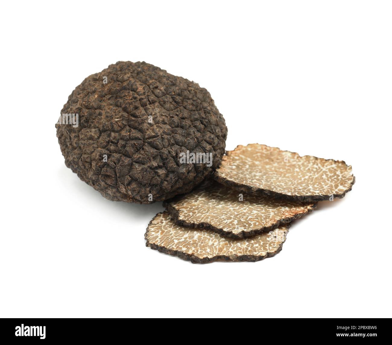 Cut and whole black truffles isolated on white Stock Photo - Alamy