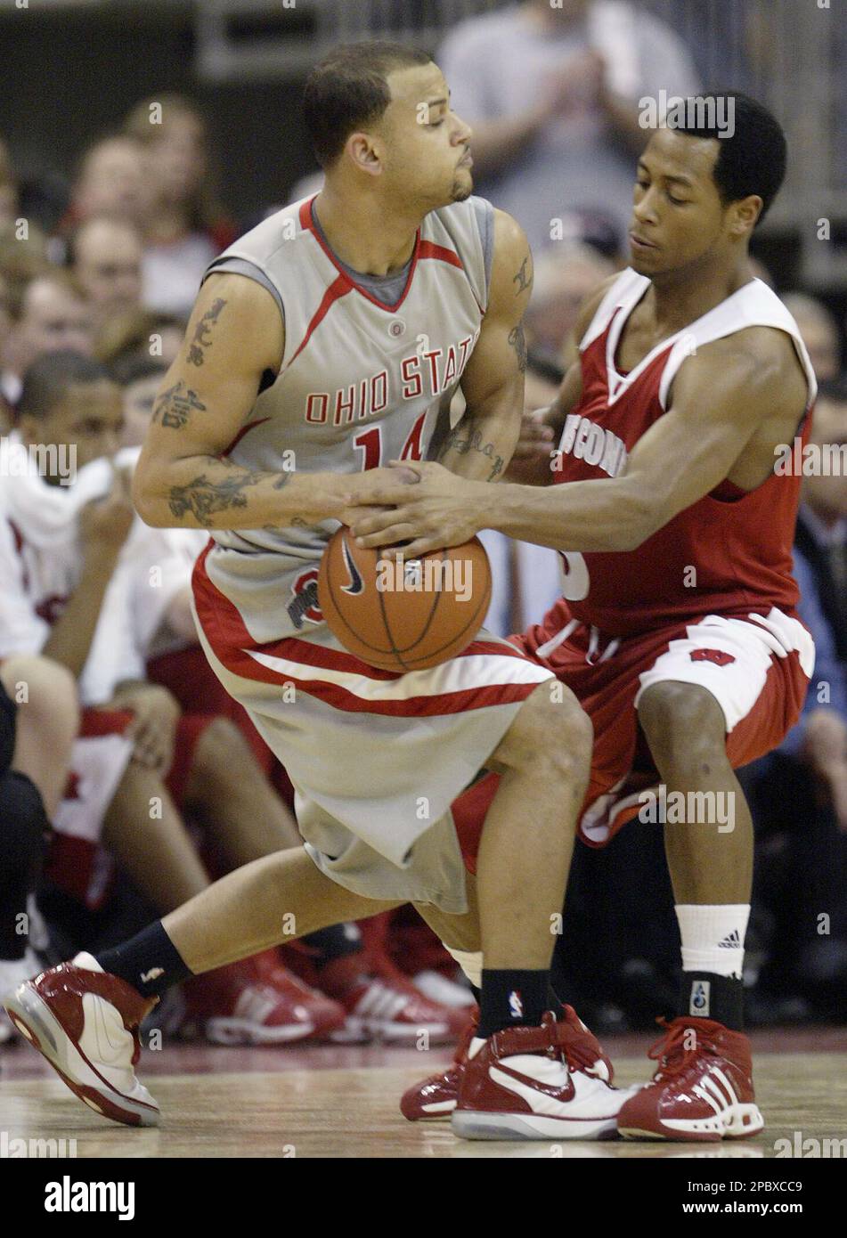 Ohio State's Jamar Butler, left, is trapped by Wisconsin's Trevon ...
