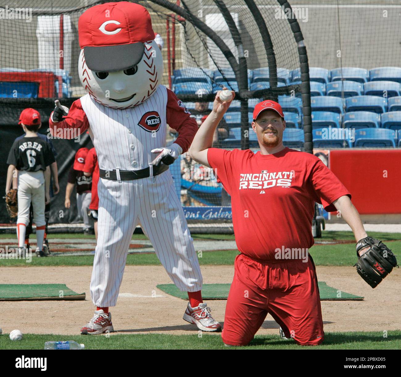 Cincinnati Reds mascot Mr. Red, left, calls balls and strikes for Reds ...