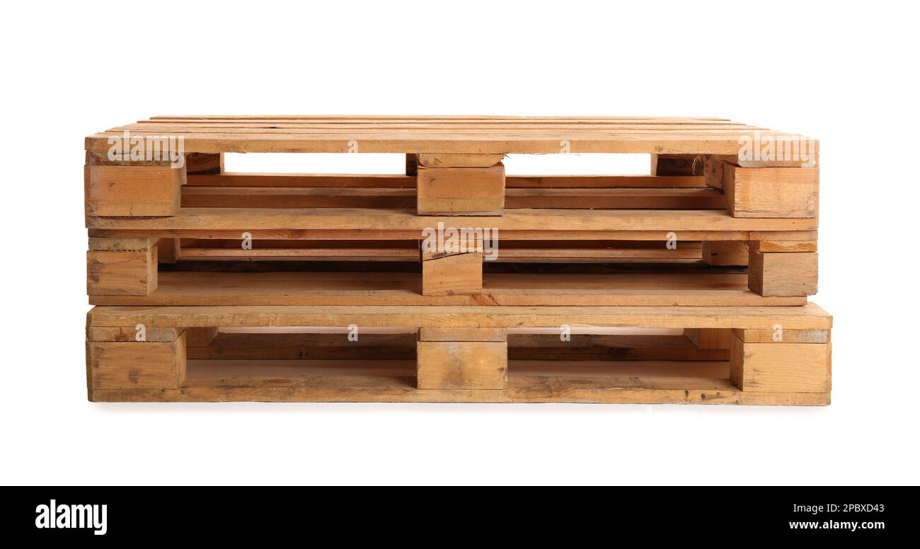 Stacked wooden pallets isolated on white. Transportation and storage ...