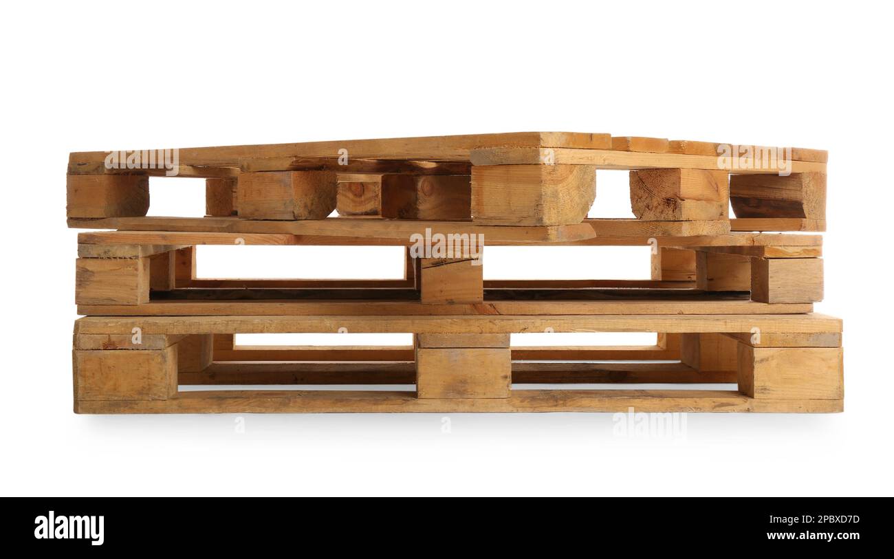 Stacked wooden pallets isolated on white. Transportation and storage ...