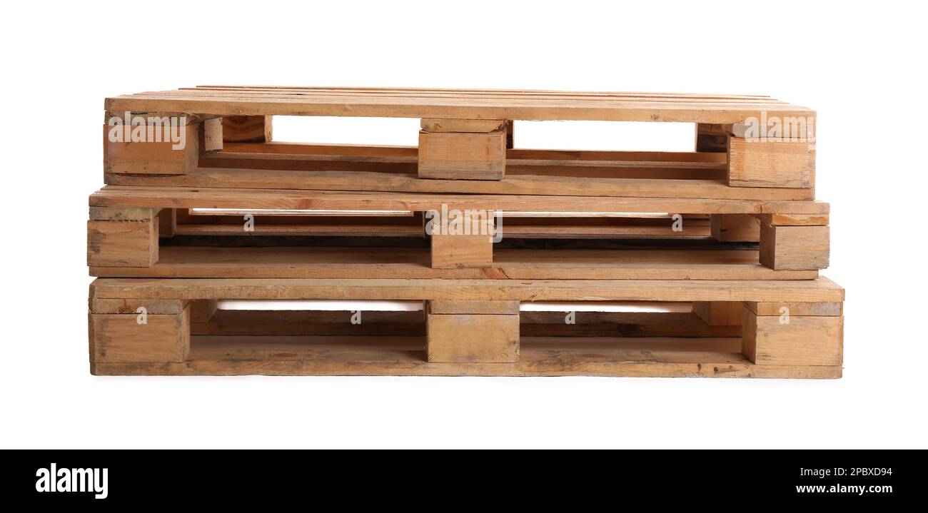 Stacked wooden pallets isolated on white. Transportation and storage ...