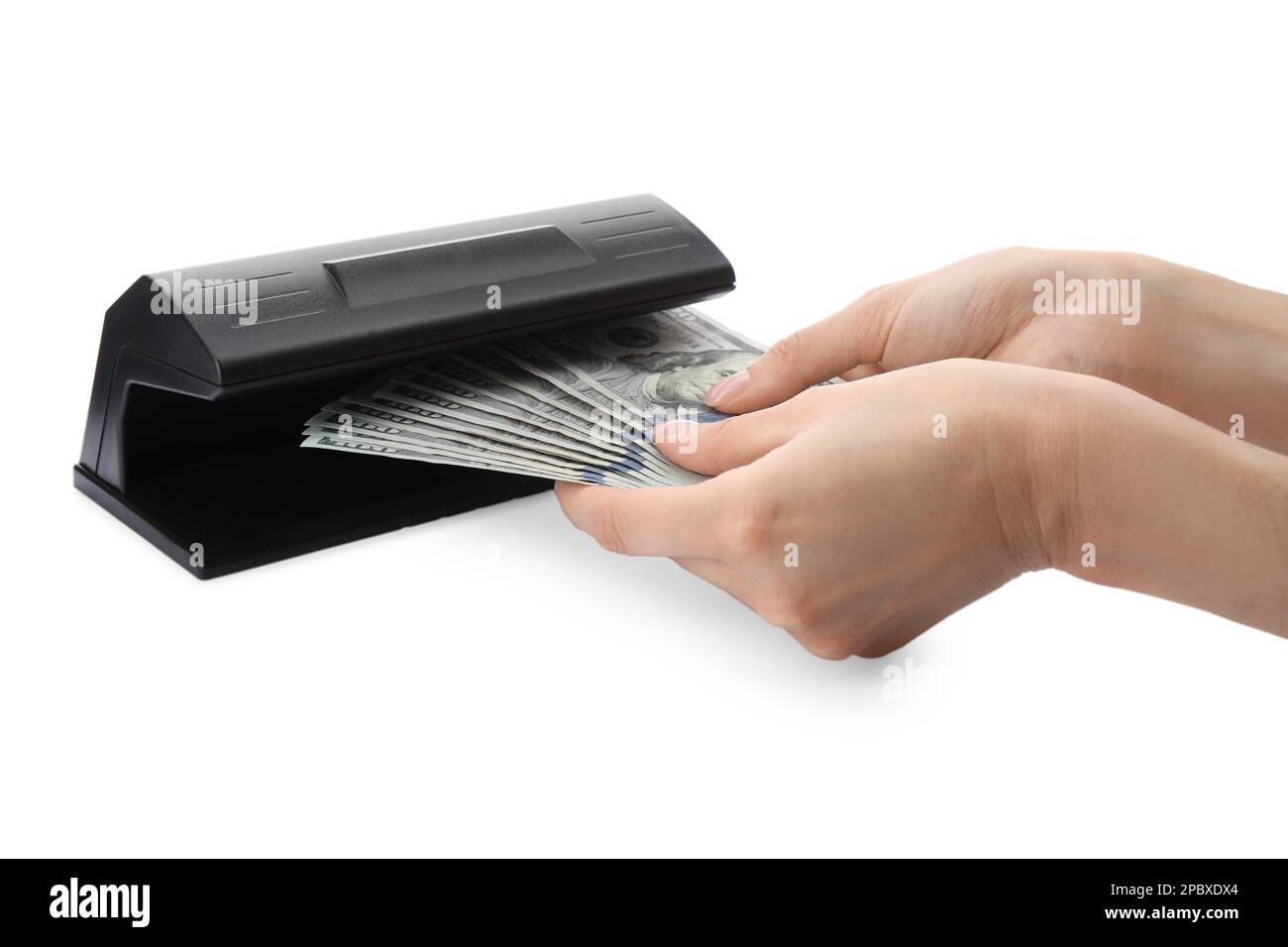 Woman checking dollar banknotes with currency detector on white ...