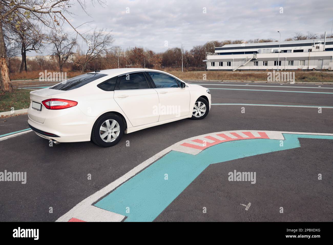 Modern car on test track with marking lines. Driving school Stock Photo ...