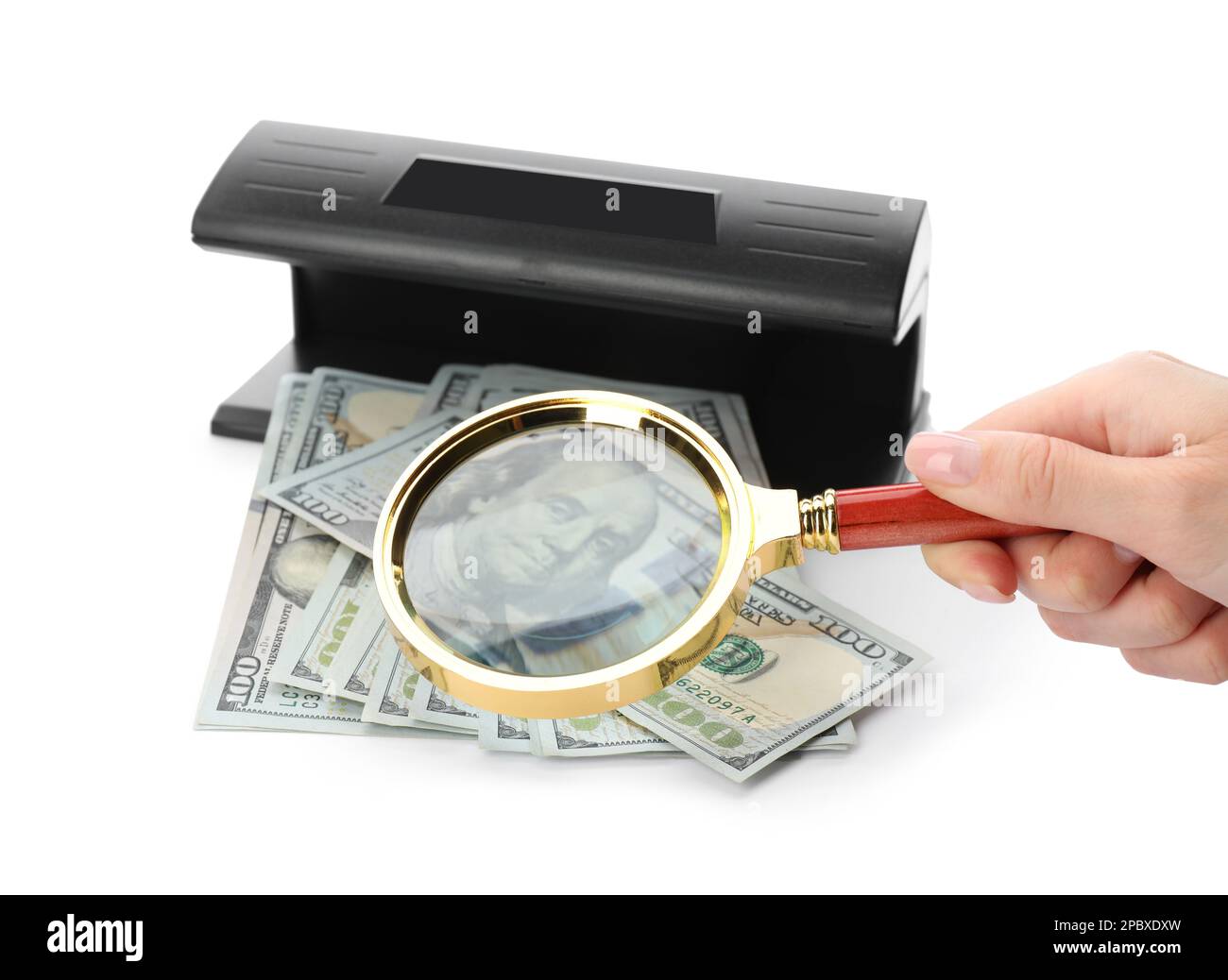 Woman checking dollar banknotes with currency detector and magnifying ...