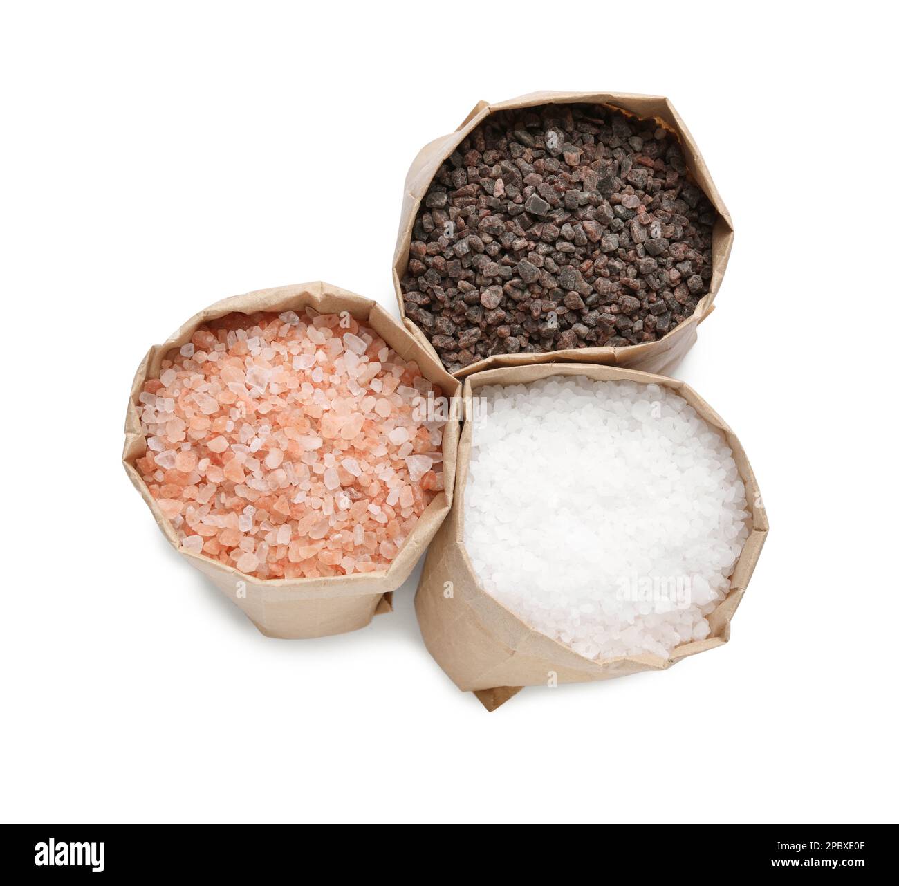 Different salts in paper bags on white background, top view Stock Photo ...