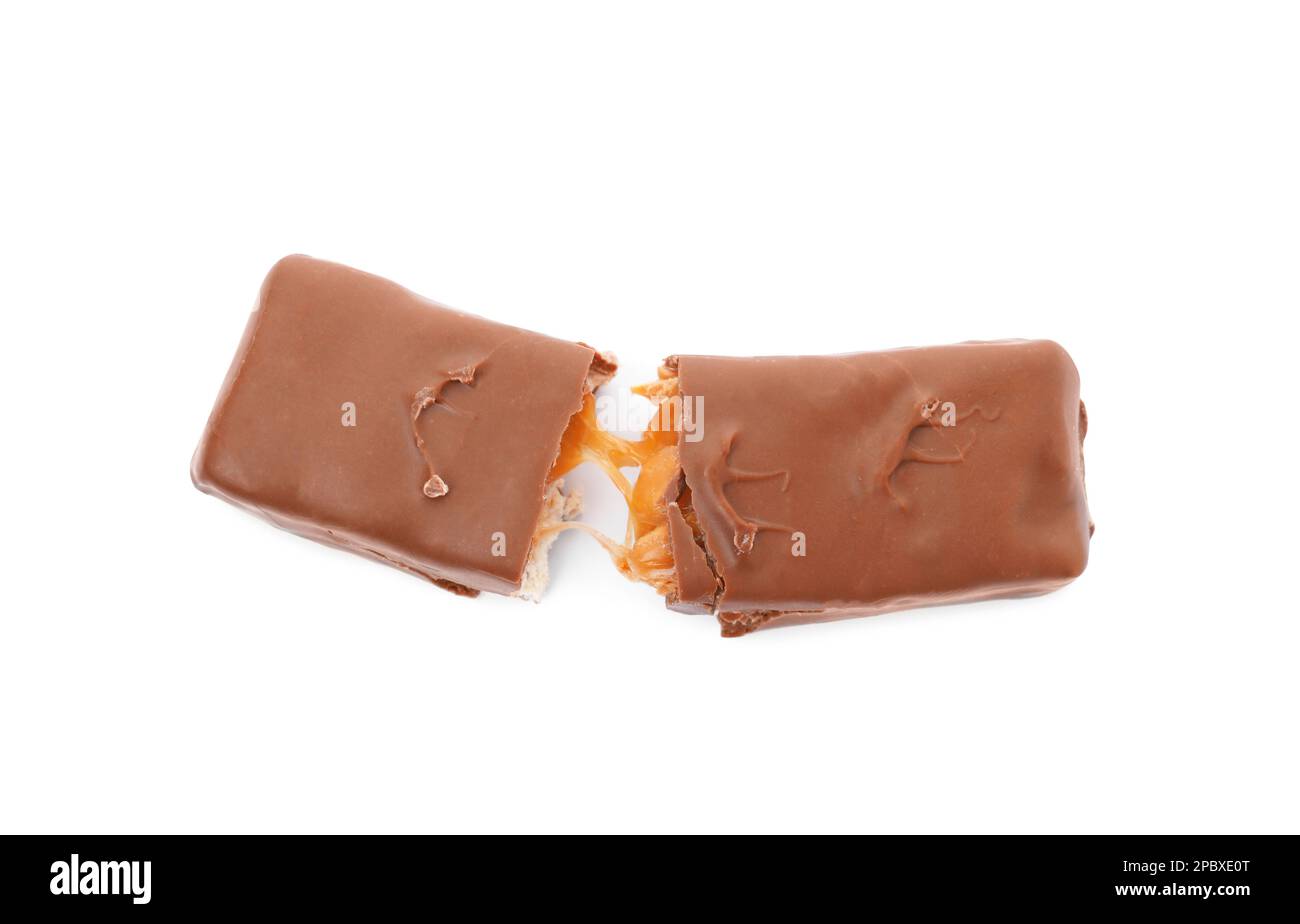 Broken chocolate bar with caramel, nuts and nougat isolated on white ...