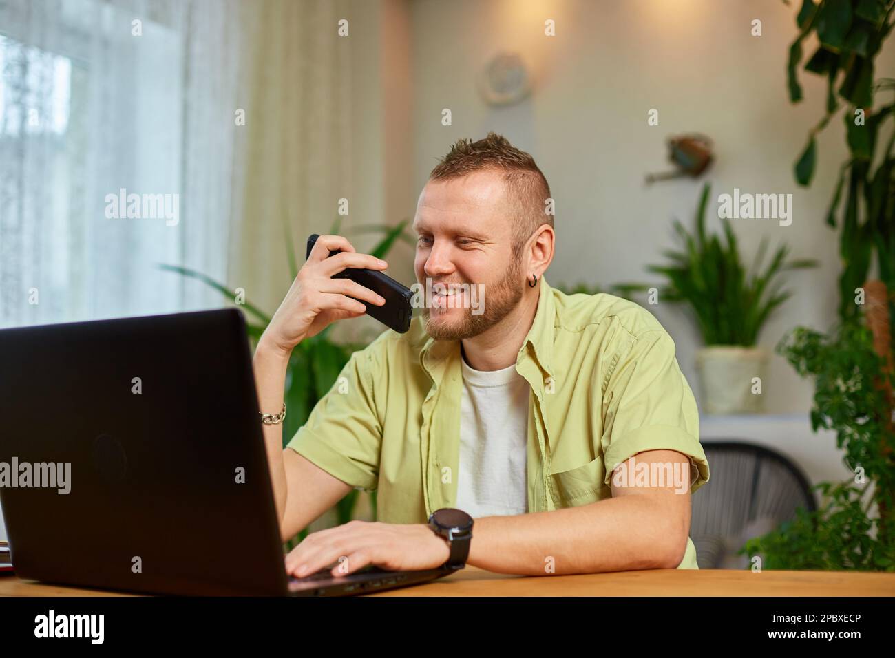 Freelancer man working with laptop on the table at home, Man use ...