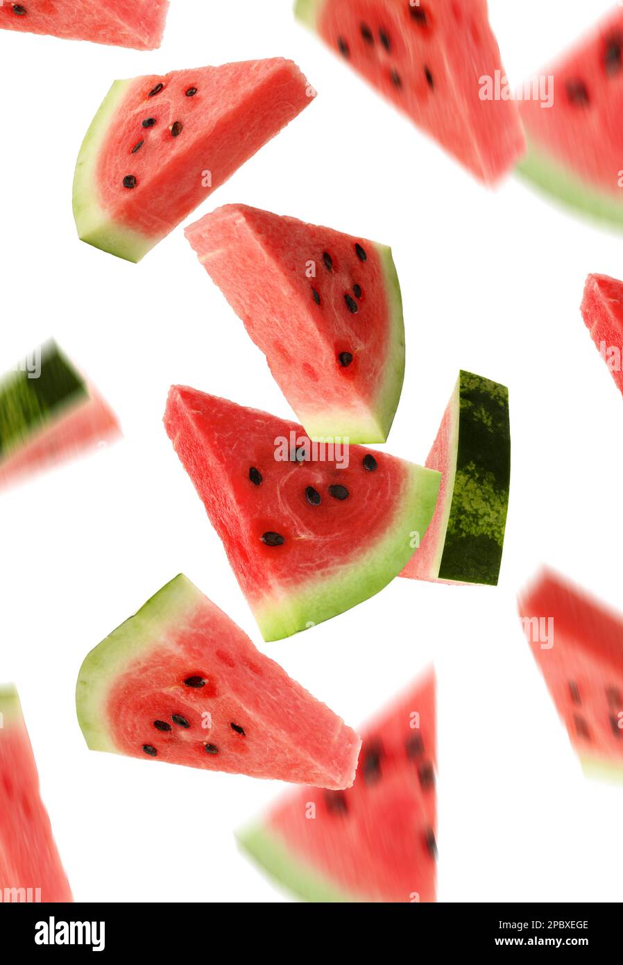 Slices of delicious ripe watermelon falling on white background Stock ...