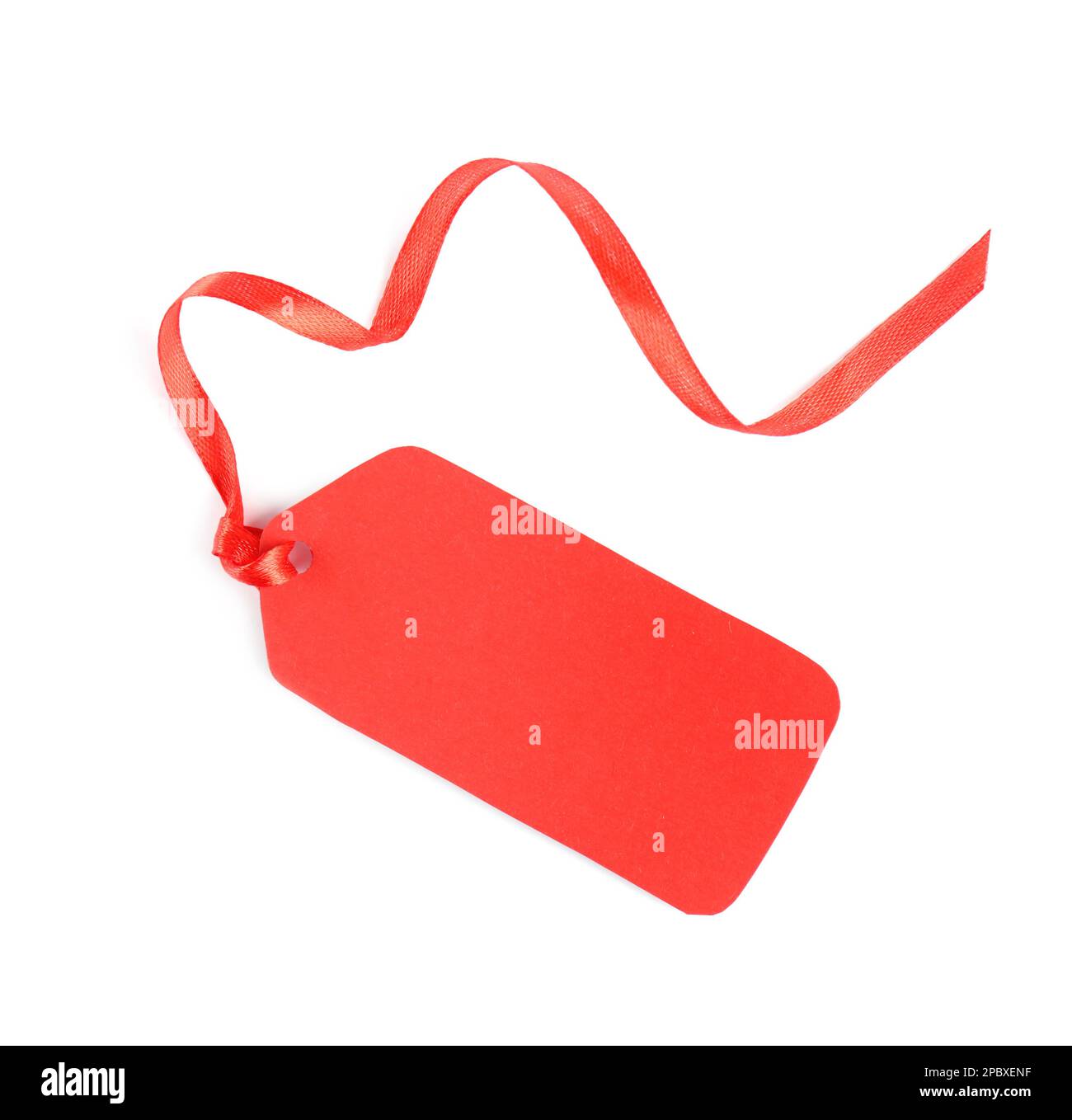 Blank red gift tag with satin ribbon on white background, top view ...