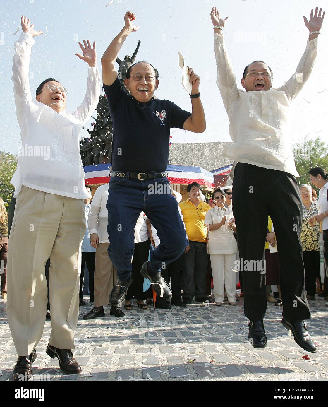 Former Philippine President Fidel Ramos, center, is joined by Foreign ...
