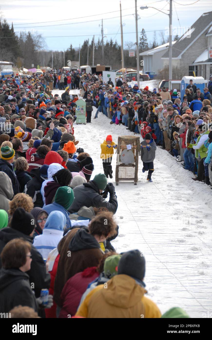 Brandon Maki and Mackenzie Richmond race their "Poop Blind" outhouse ...