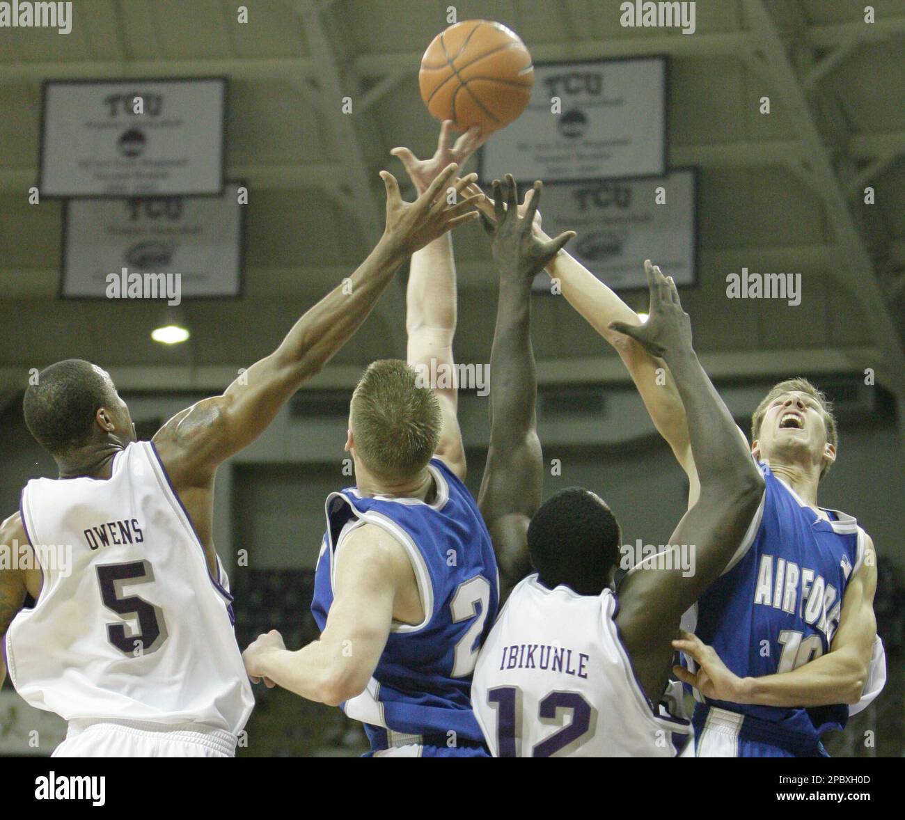 Air Force's Andrew Henke (10) and Ryan Teets (2) battle for a rebound ...
